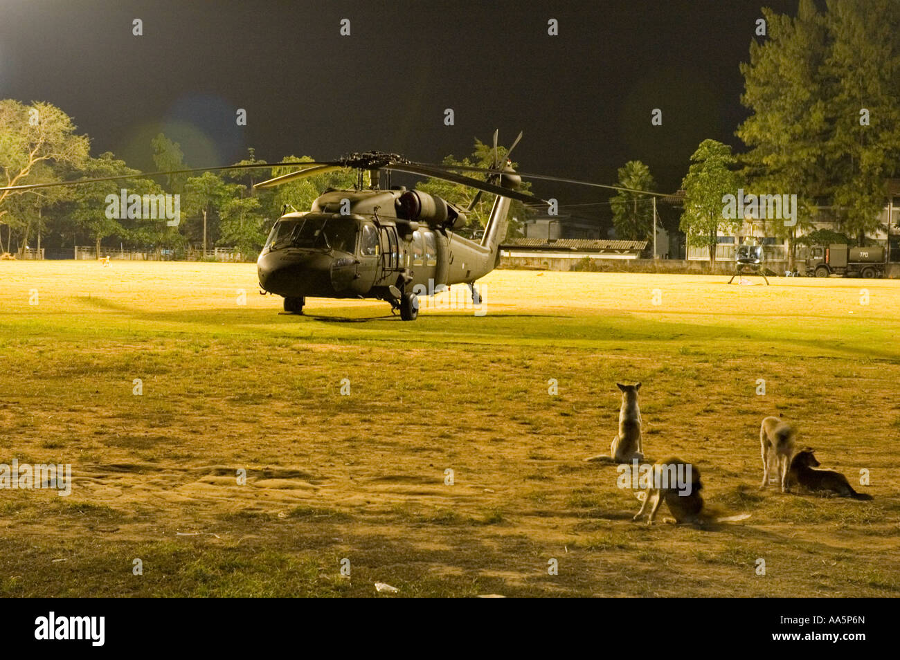 Military Helicopter stationary on a landing pad on a sports field in ...