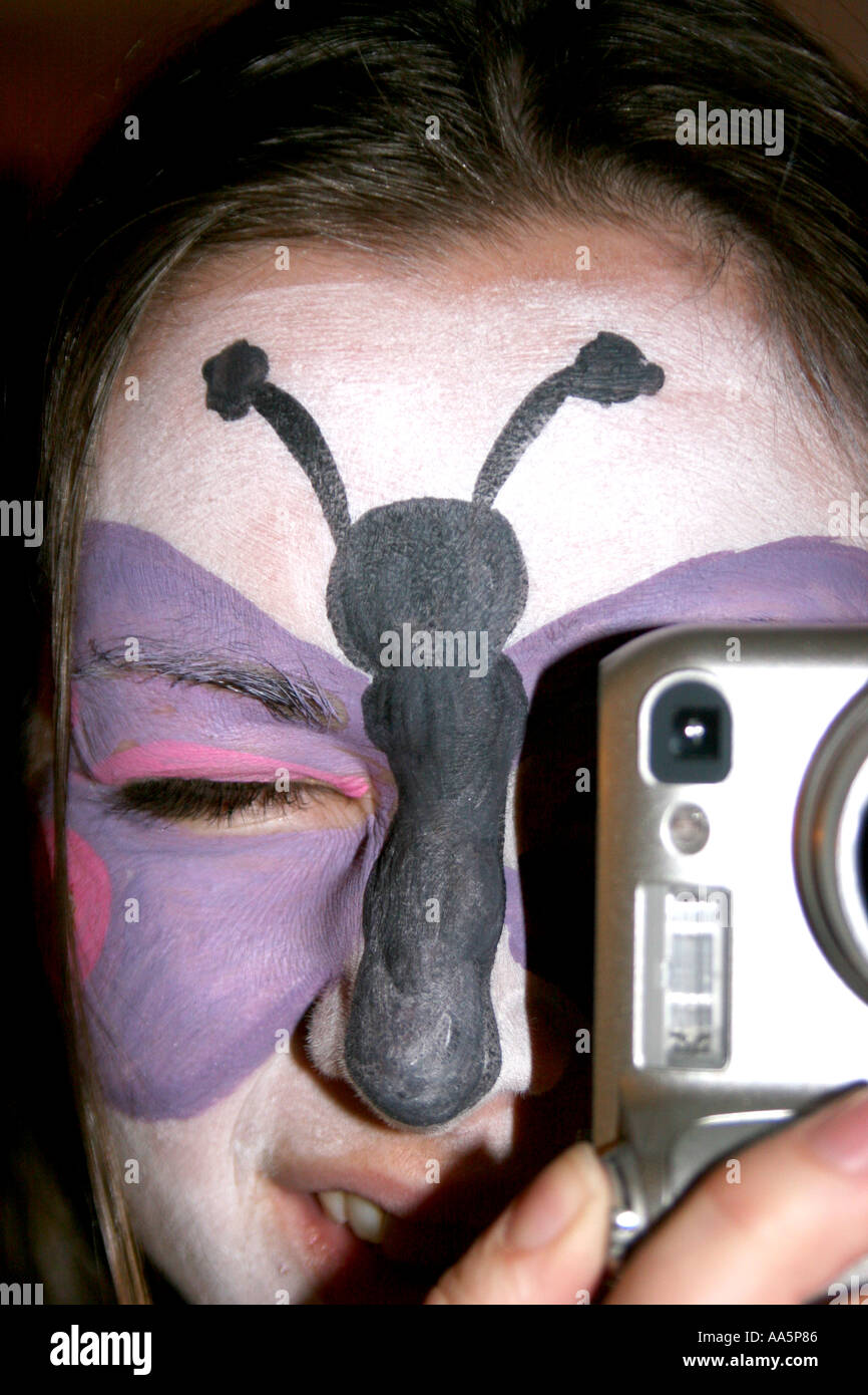 taking picture at a party facing camera with face paints Stock Photo ...