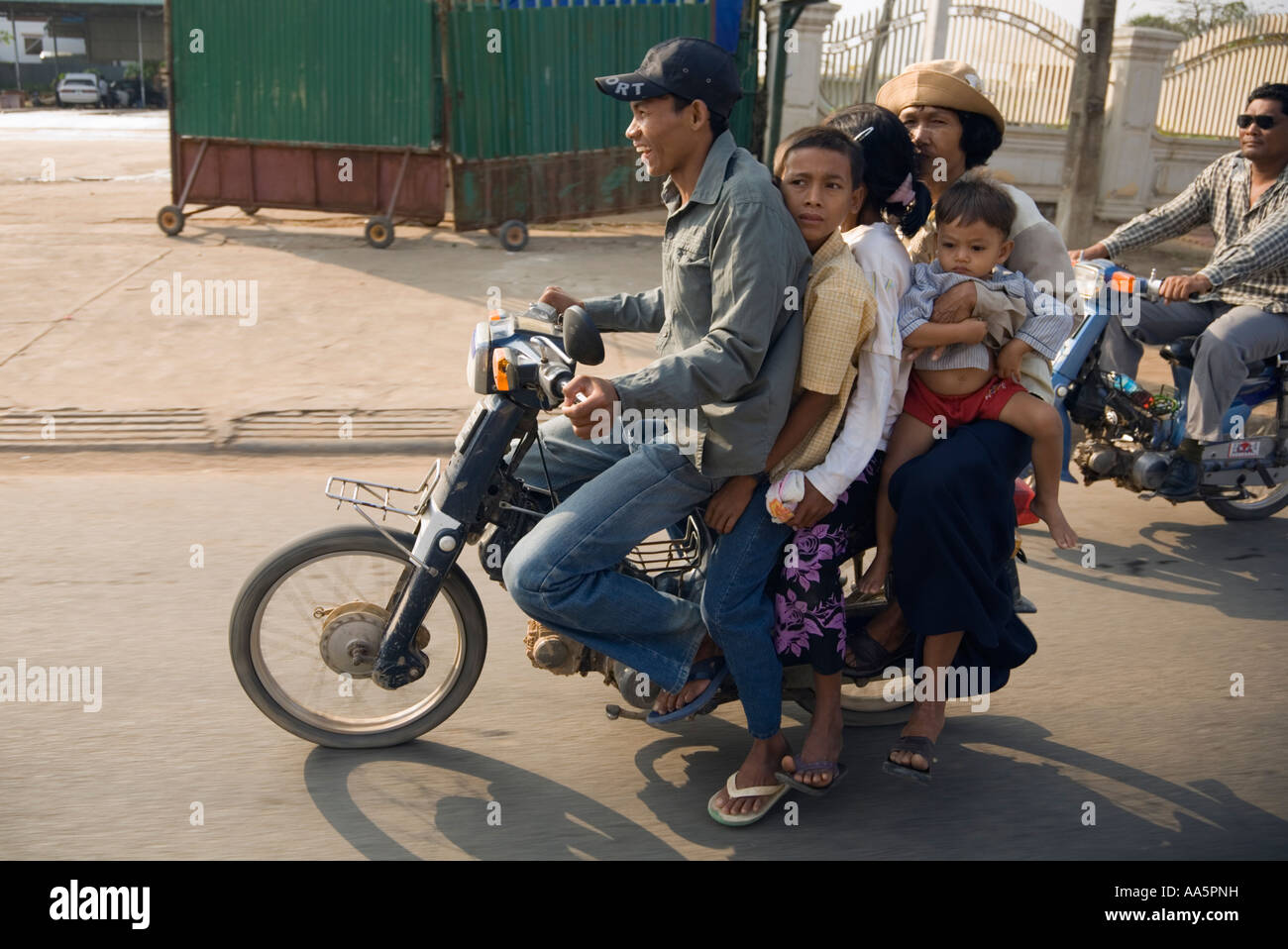 Five people on a motor scooter hi-res stock photography and images - Alamy