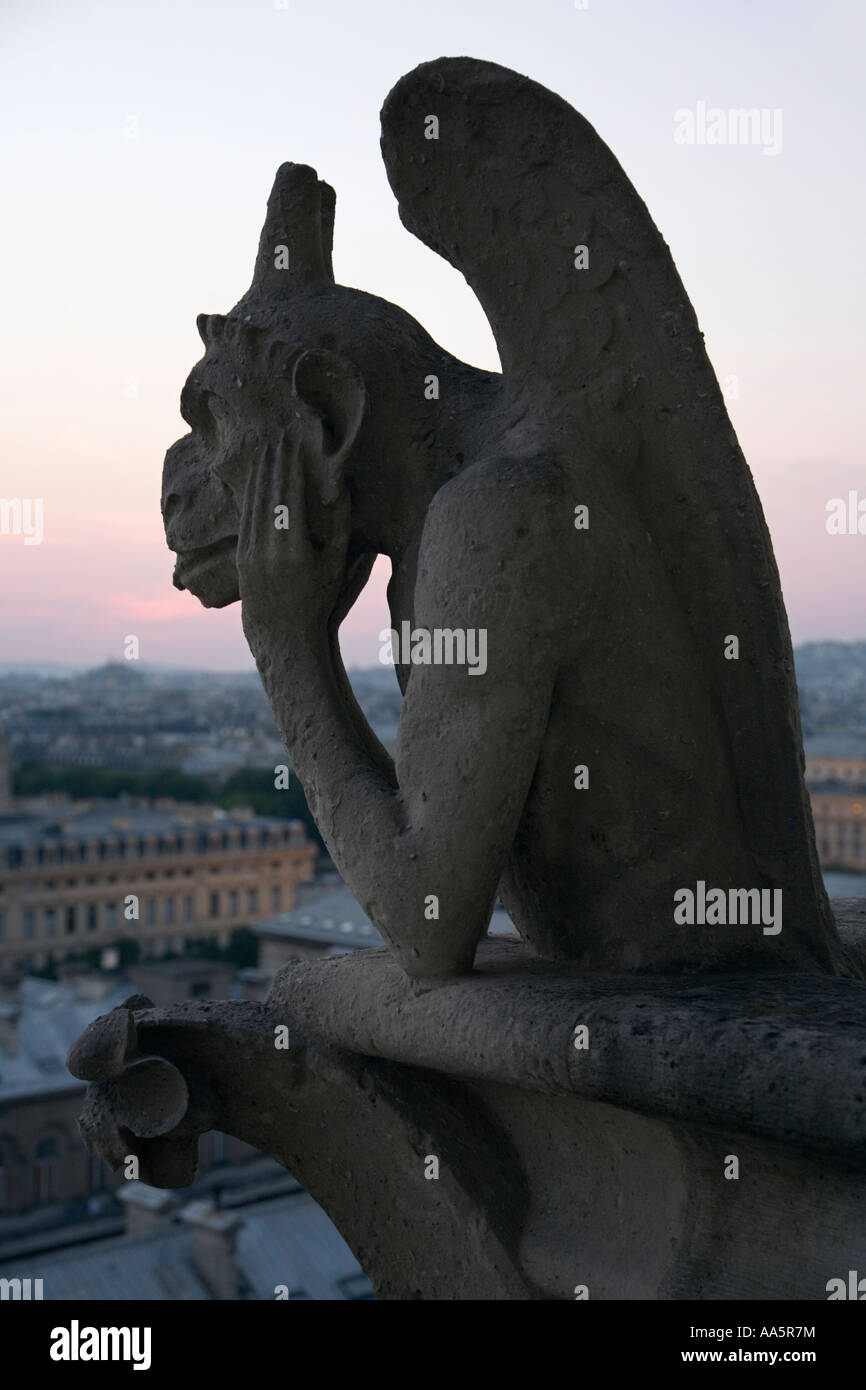 Paris, France. The Stryga gargoyle at Notre Dame Cathedral, sunset ...