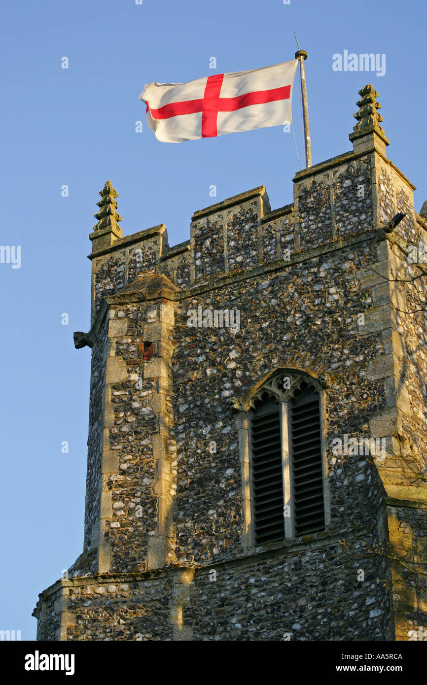Typical English church tower in evening sun flying the St Saint Georges ...