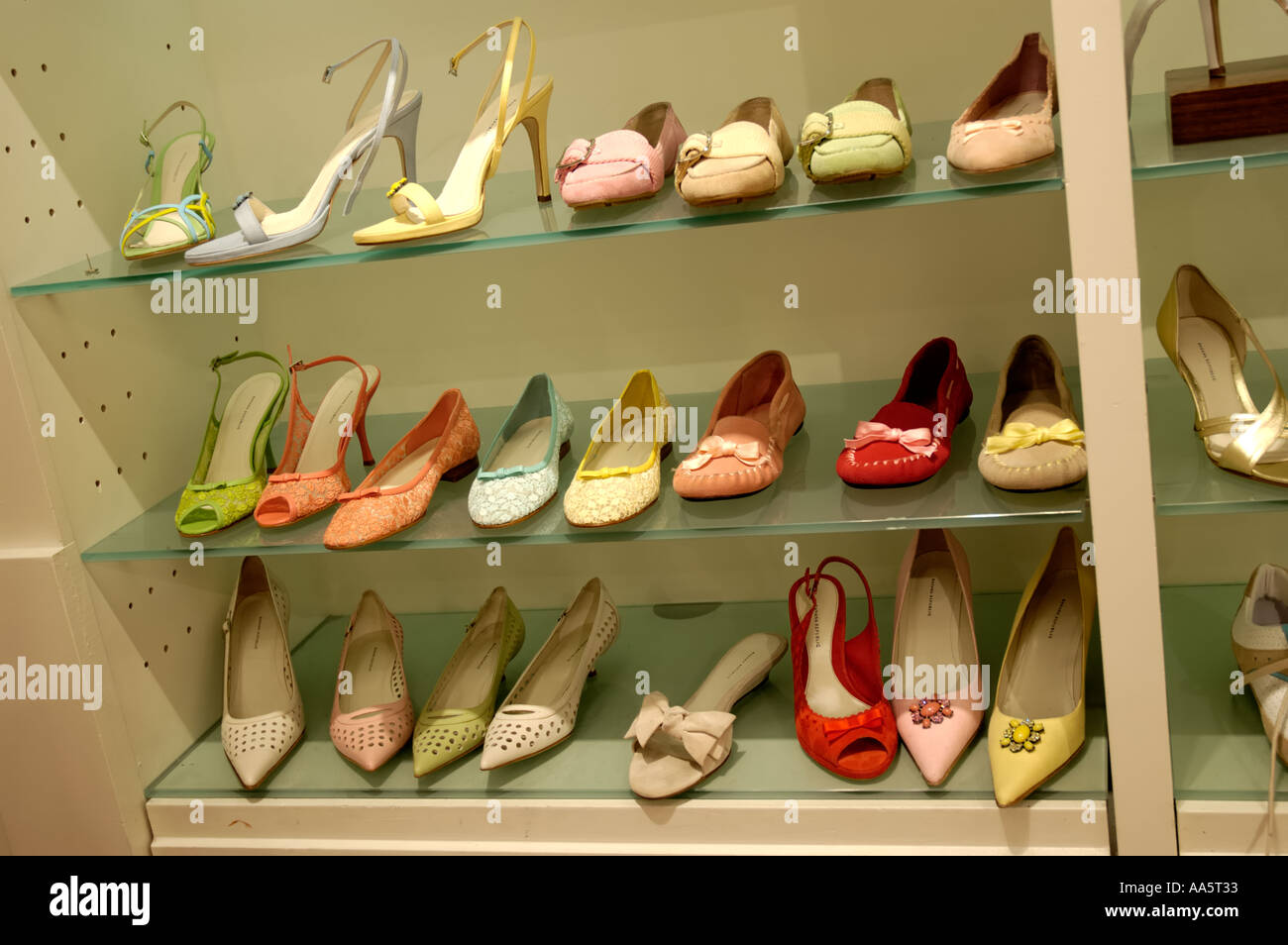 Shoes on shelves at store Stock Photo - Alamy