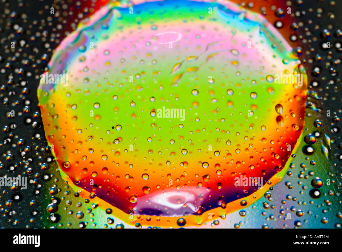 Large drop of silicone oil with mist spray droplets Stock Photo - Alamy