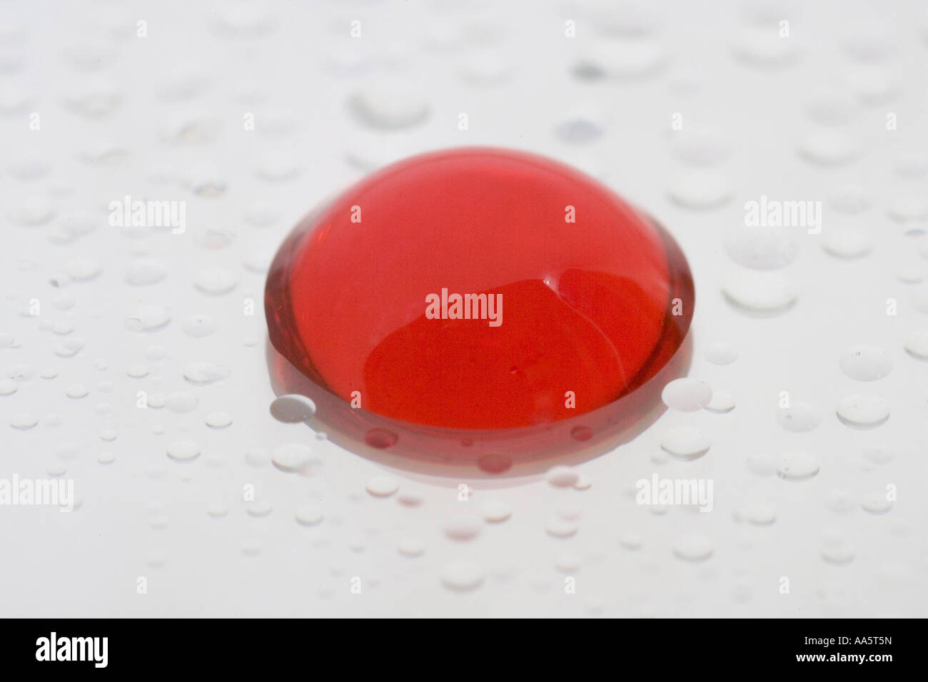 Drop of red liquid similar to blood Stock Photo - Alamy