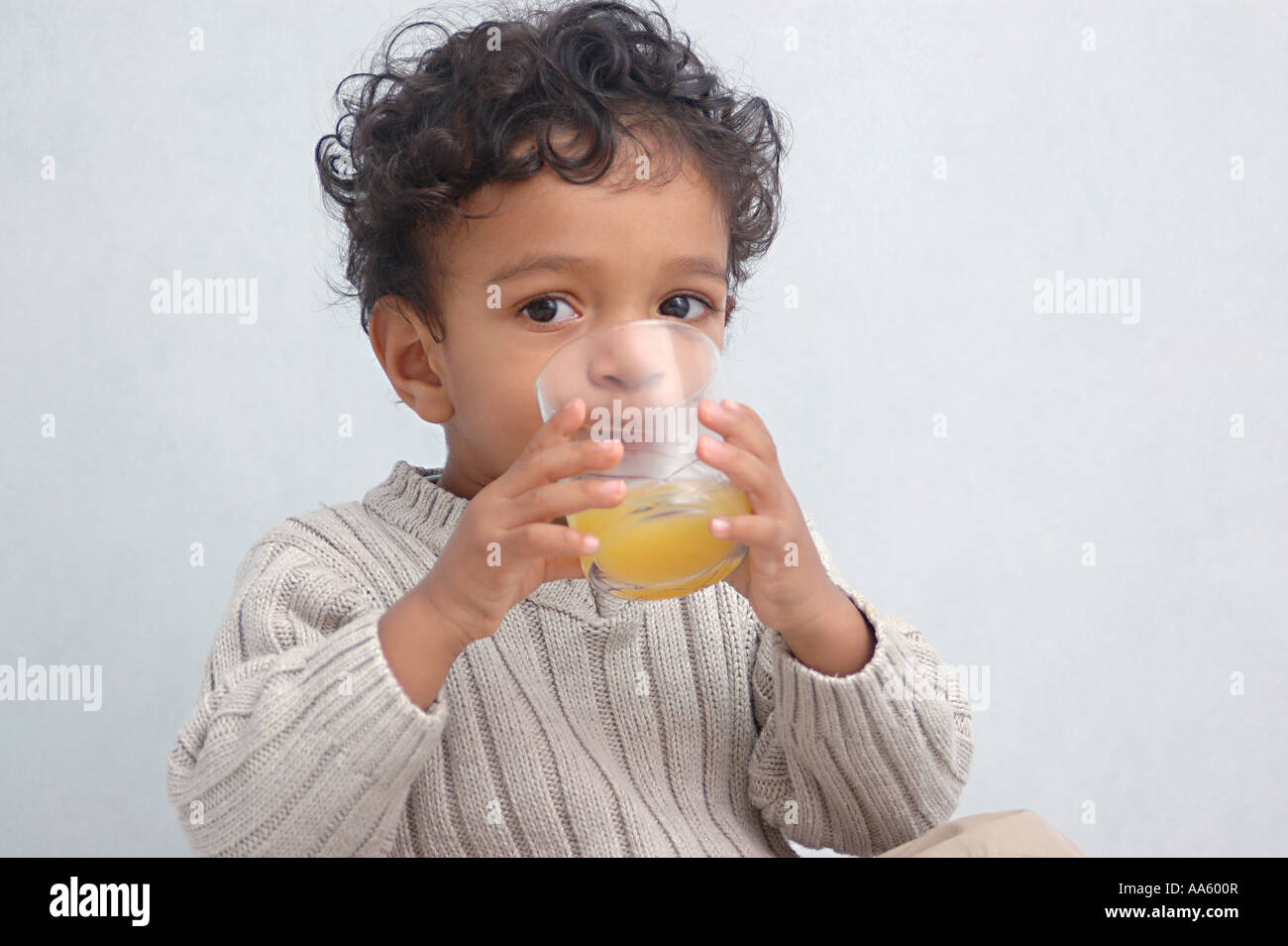 ANG104035 Small Indian boy of two and half years drinking juice Model ...
