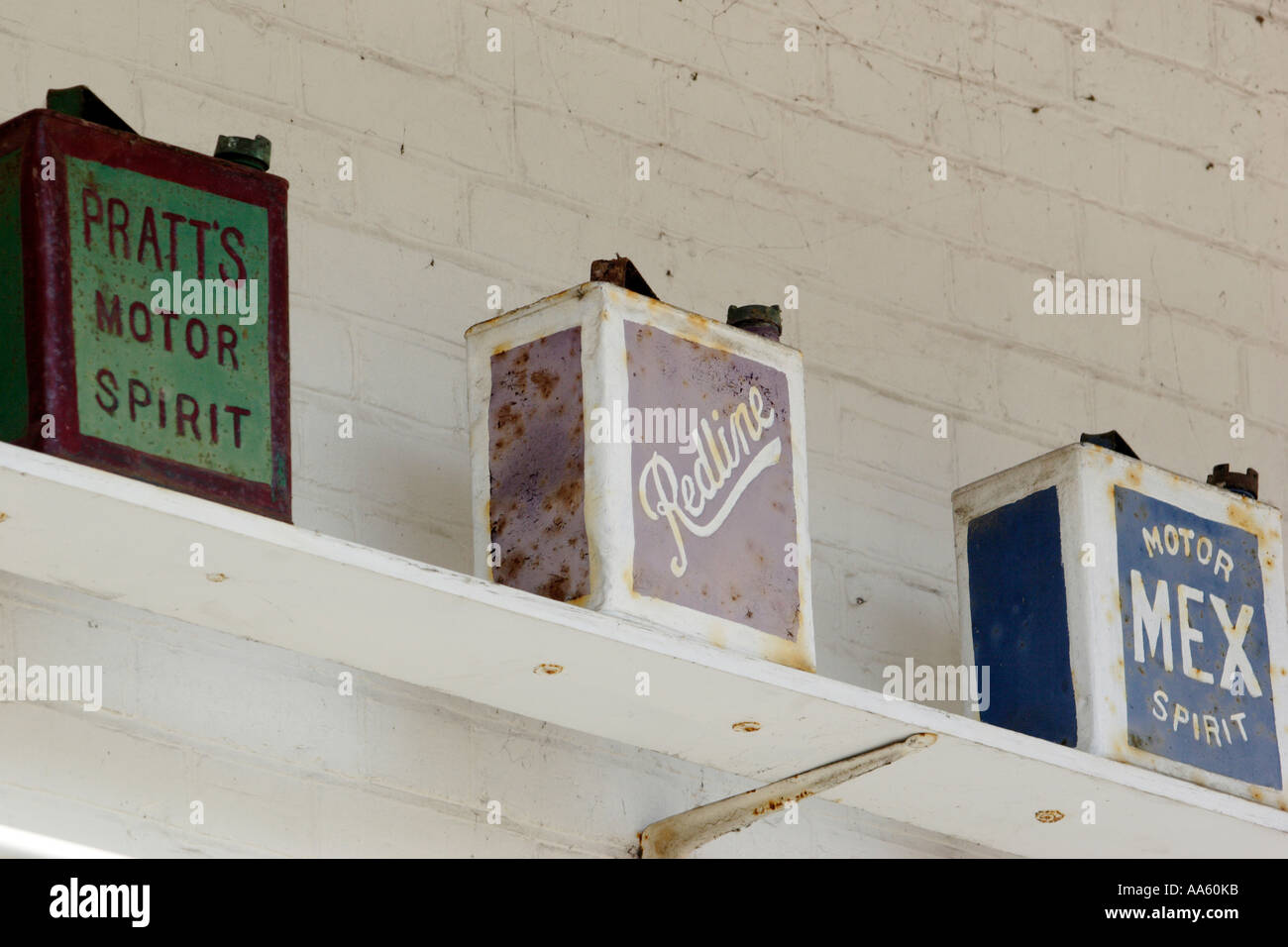 Oil cans in a garage Stock Photo - Alamy
