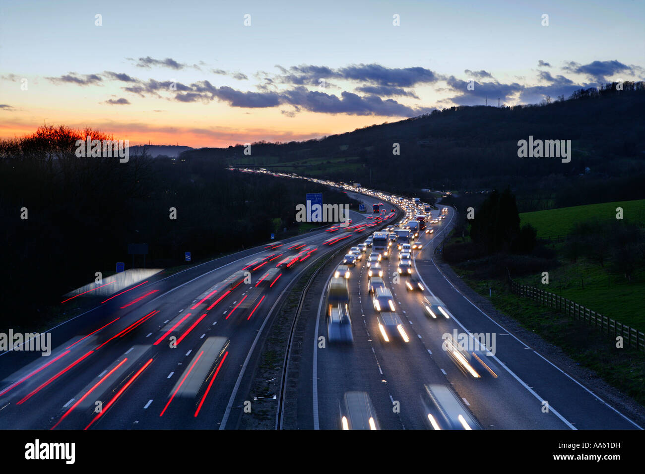 Blurred rush hour traffic on M25 motorway at dusk Stock Photo - Alamy