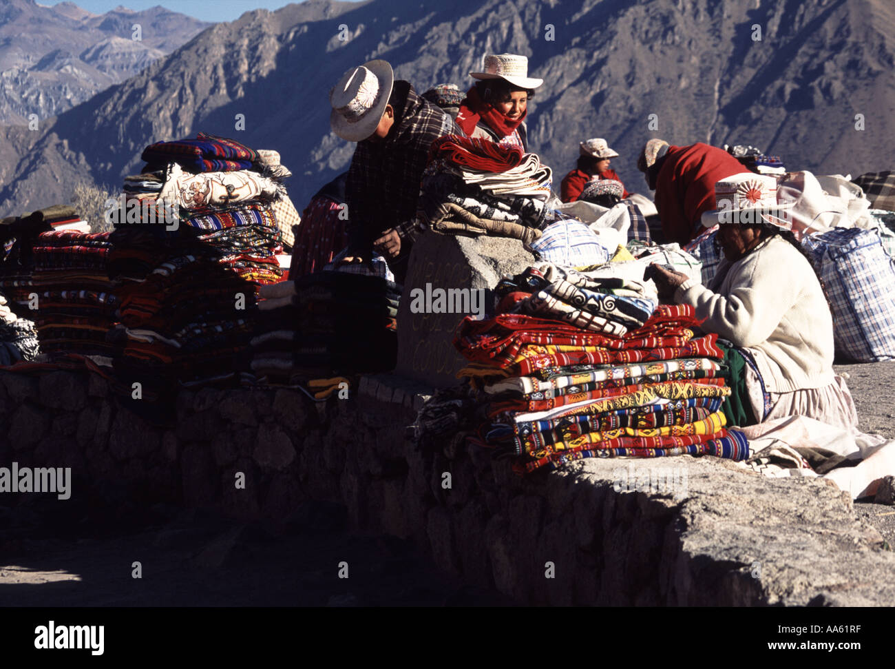 Women selling clothing made from alpaca wool in the Colca Canyon region ...