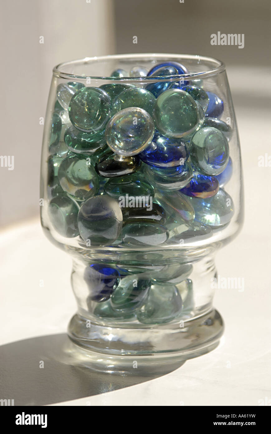 Marbles in glass container Stock Photo - Alamy