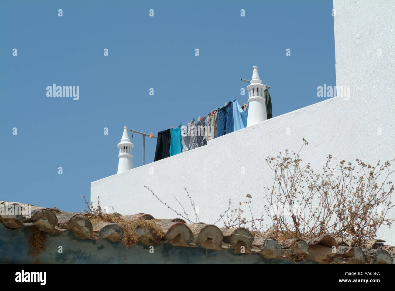 Traditional Chimneys and Washing Line at Alvor Portugal Stock Photo - Alamy