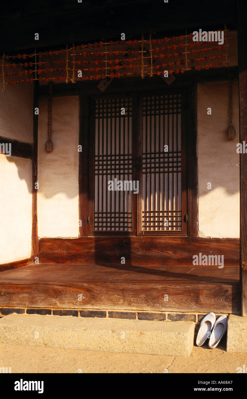 Korean traditional paper shutters with dried fruit hanging and ...