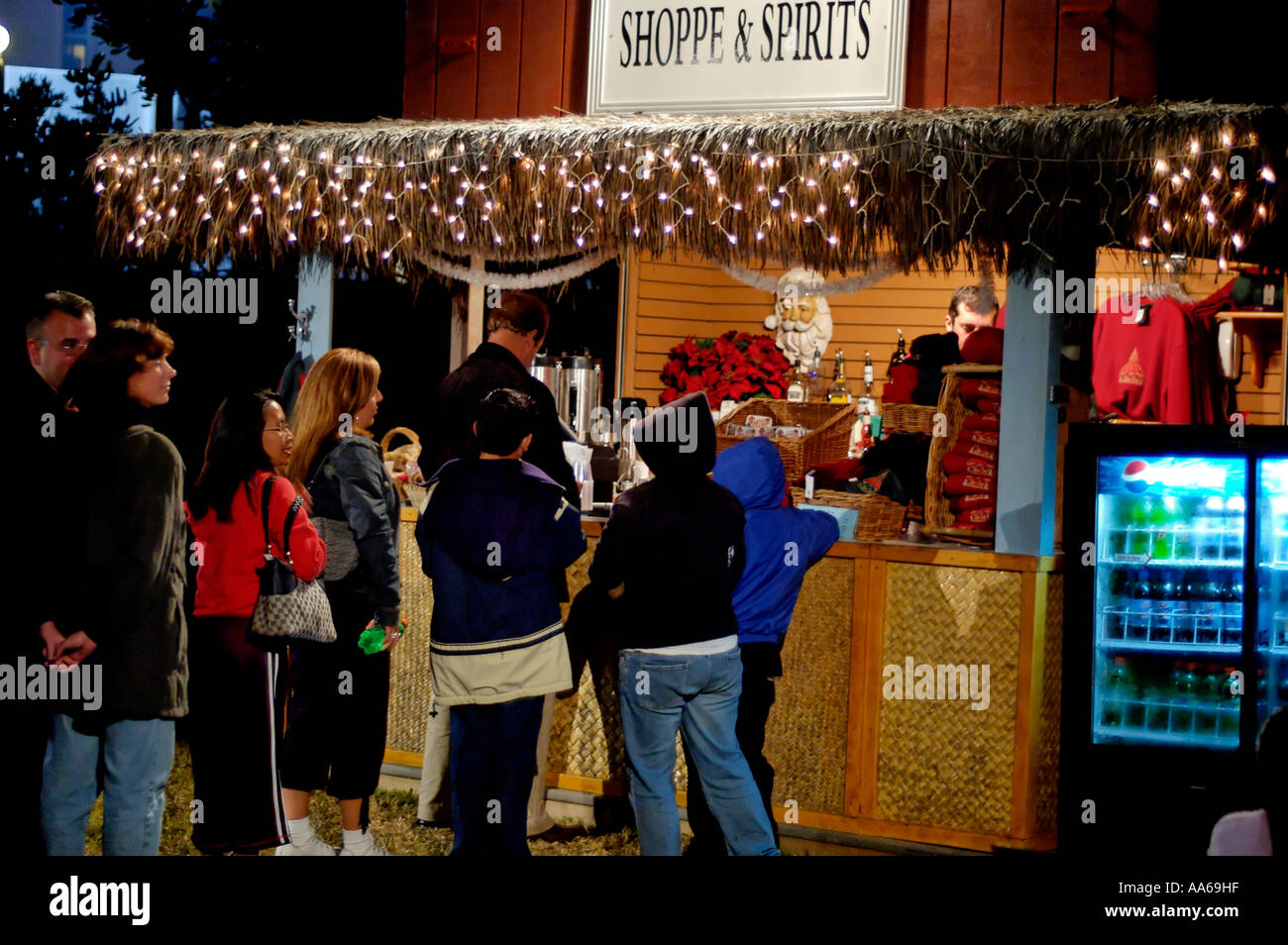 People lined up at refreshment stand at the Hotel Del Coronado at night ...