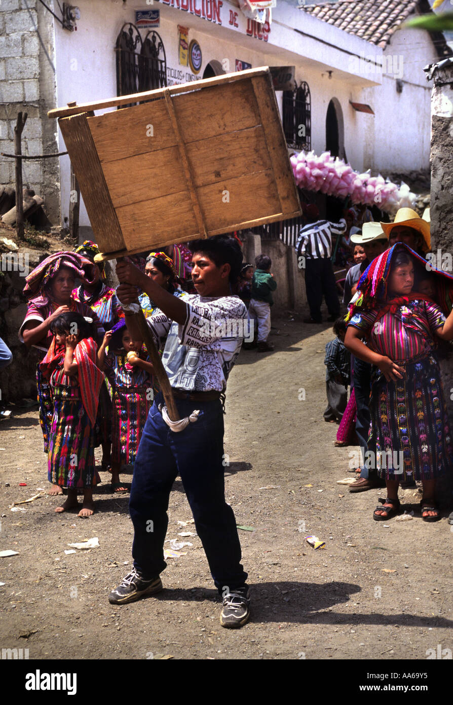 A QUICHE MAYAN MAN WITH A GIANT RATTLE DURING SEMANA SANTA CELEBRATIONS ...