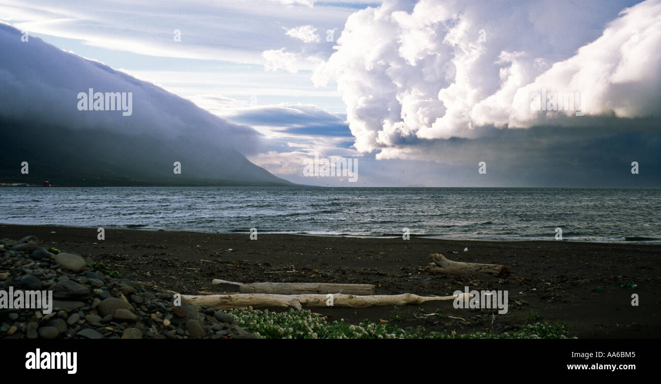 Clouded sky Clouds building over water, storm emerging during summer in ...