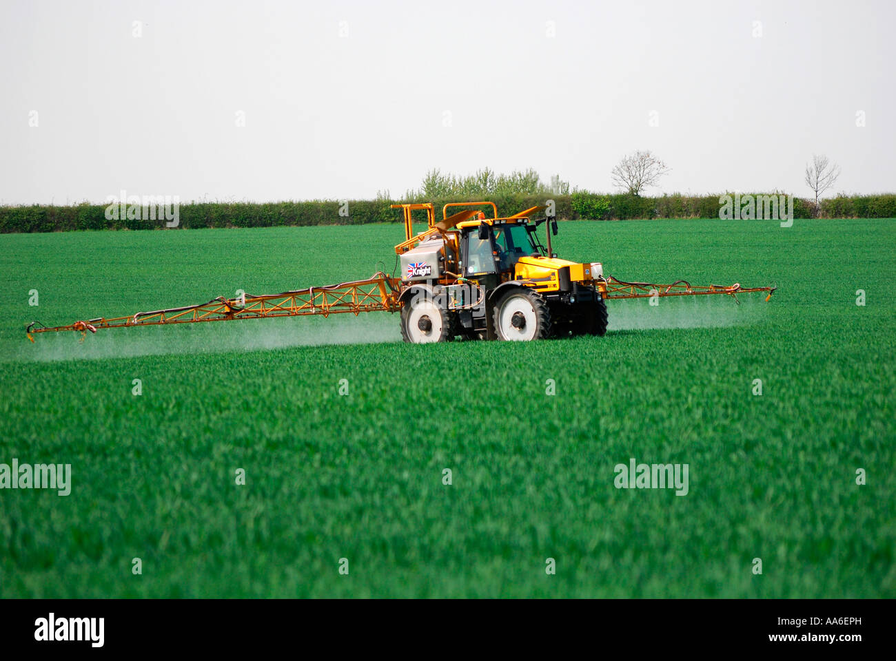 Farming tractor spraying field crop hi-res stock photography and images ...