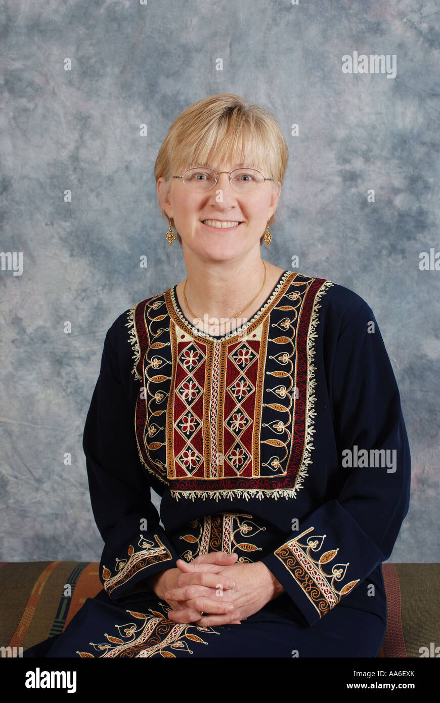 Thirty-something women sitting for her portrait Stock Photo - Alamy