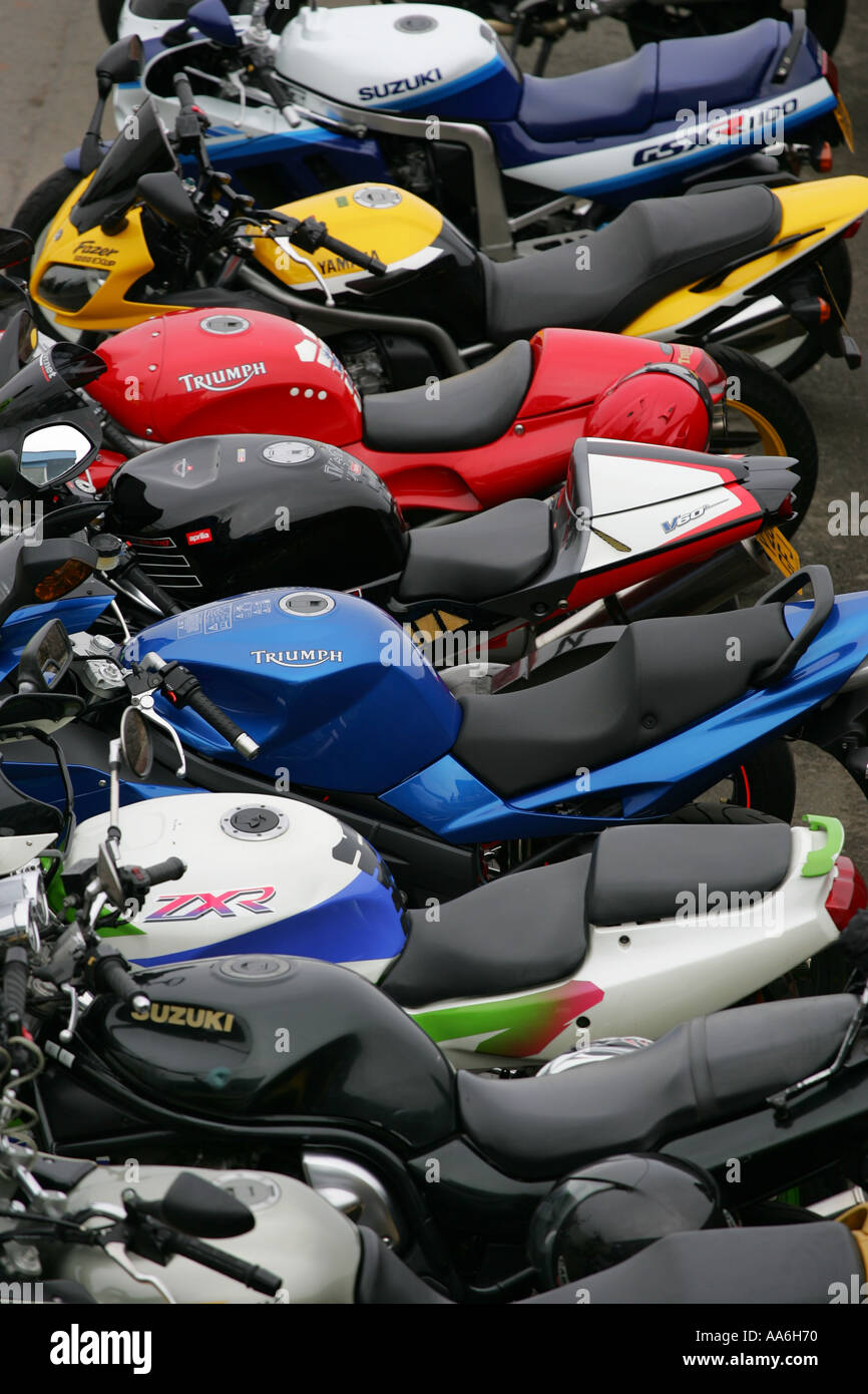 Aerial view of a row of brightly coloured parked sports motorbikes ...