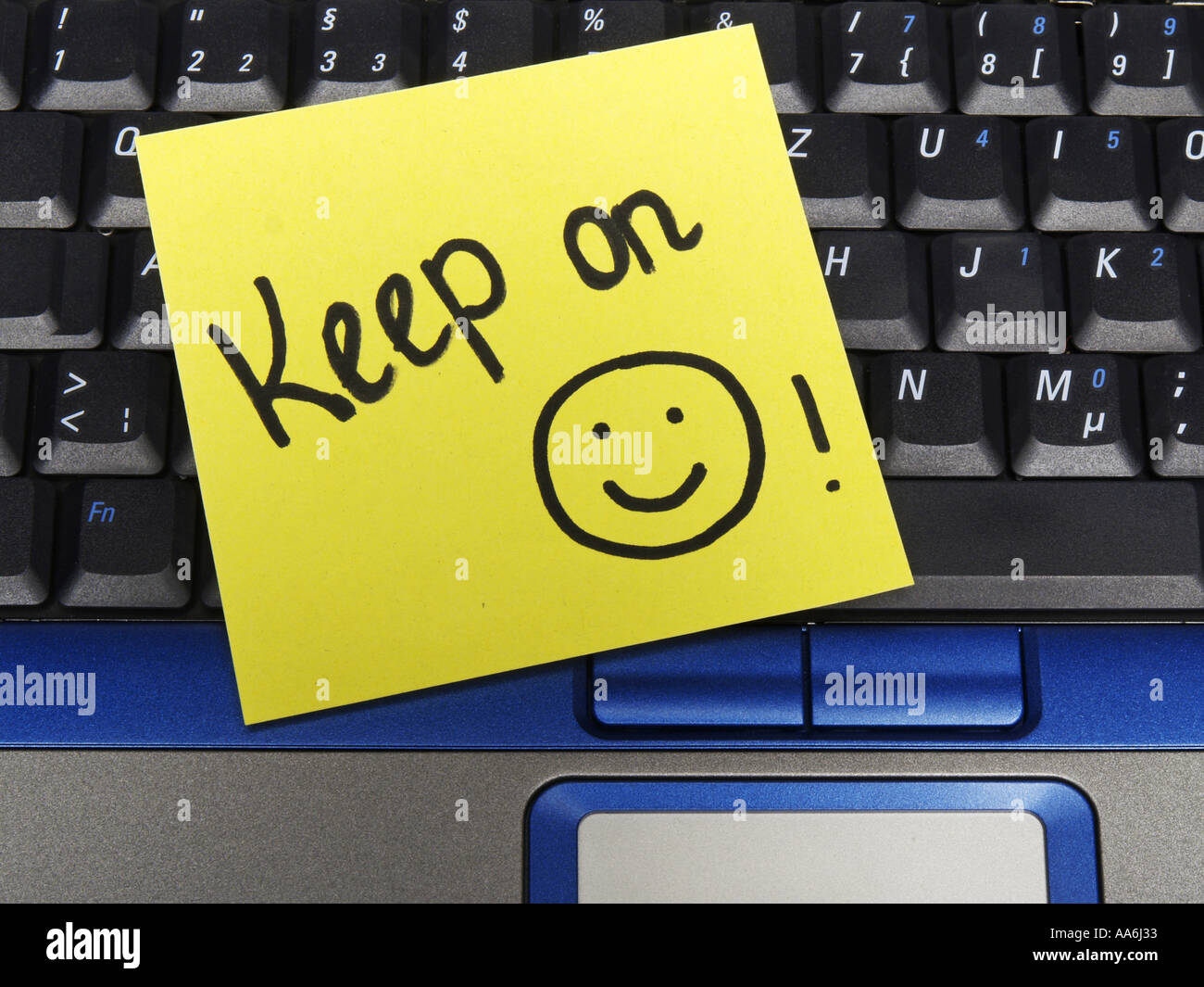 memo note on notebook, keep on with a smiley Stock Photo - Alamy