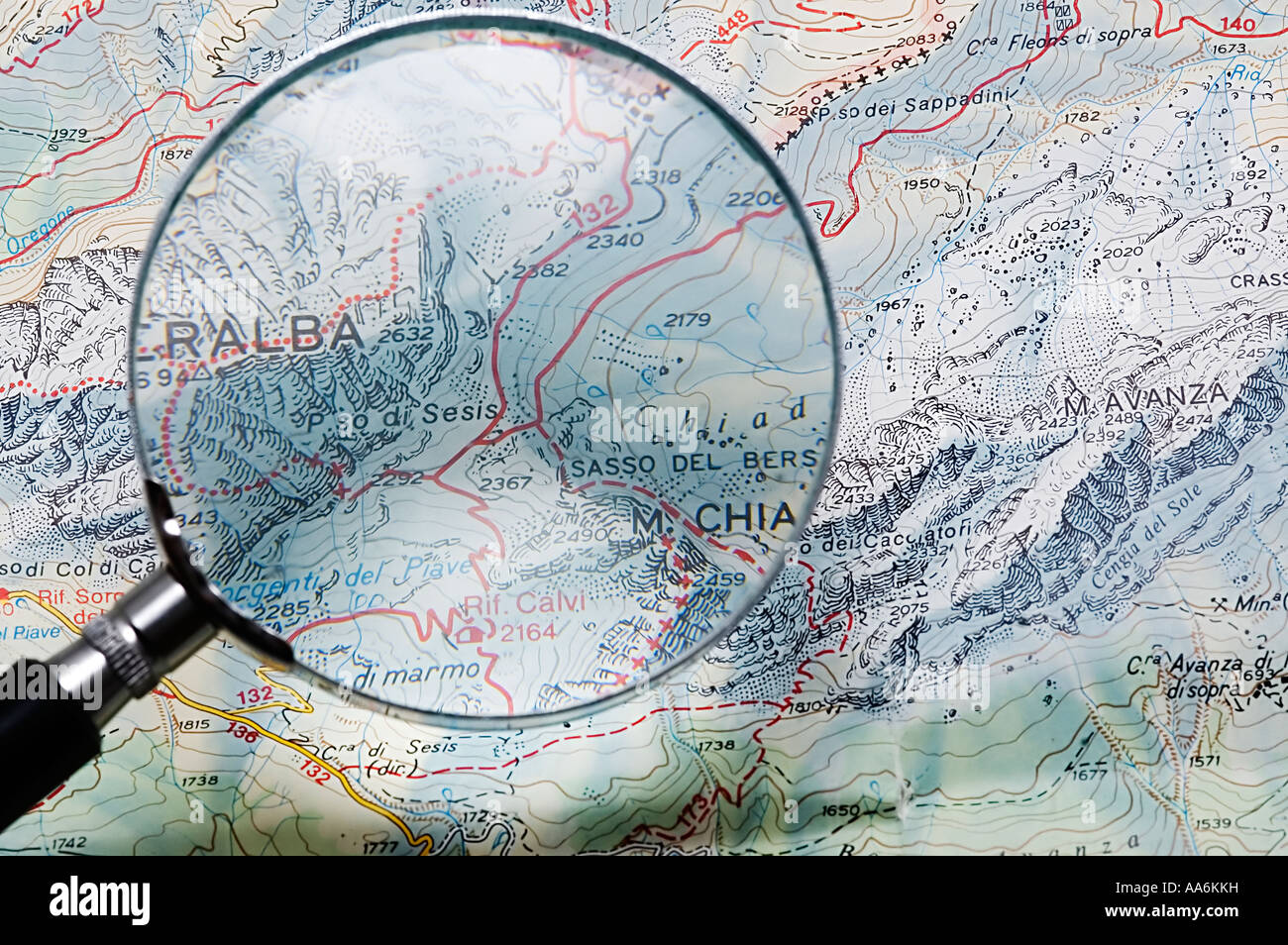 to look a map with a magnifying glass Stock Photo - Alamy