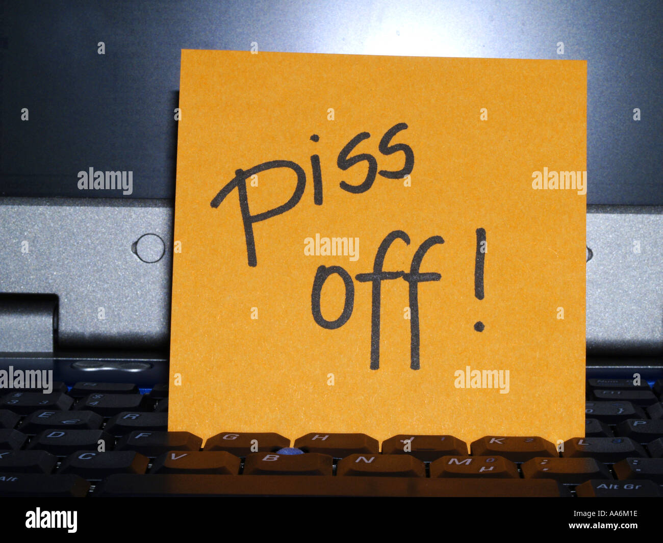 memo note on notebook, piss off Stock Photo - Alamy