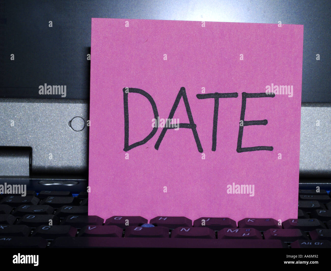 memo note on notebook date Stock Photo - Alamy