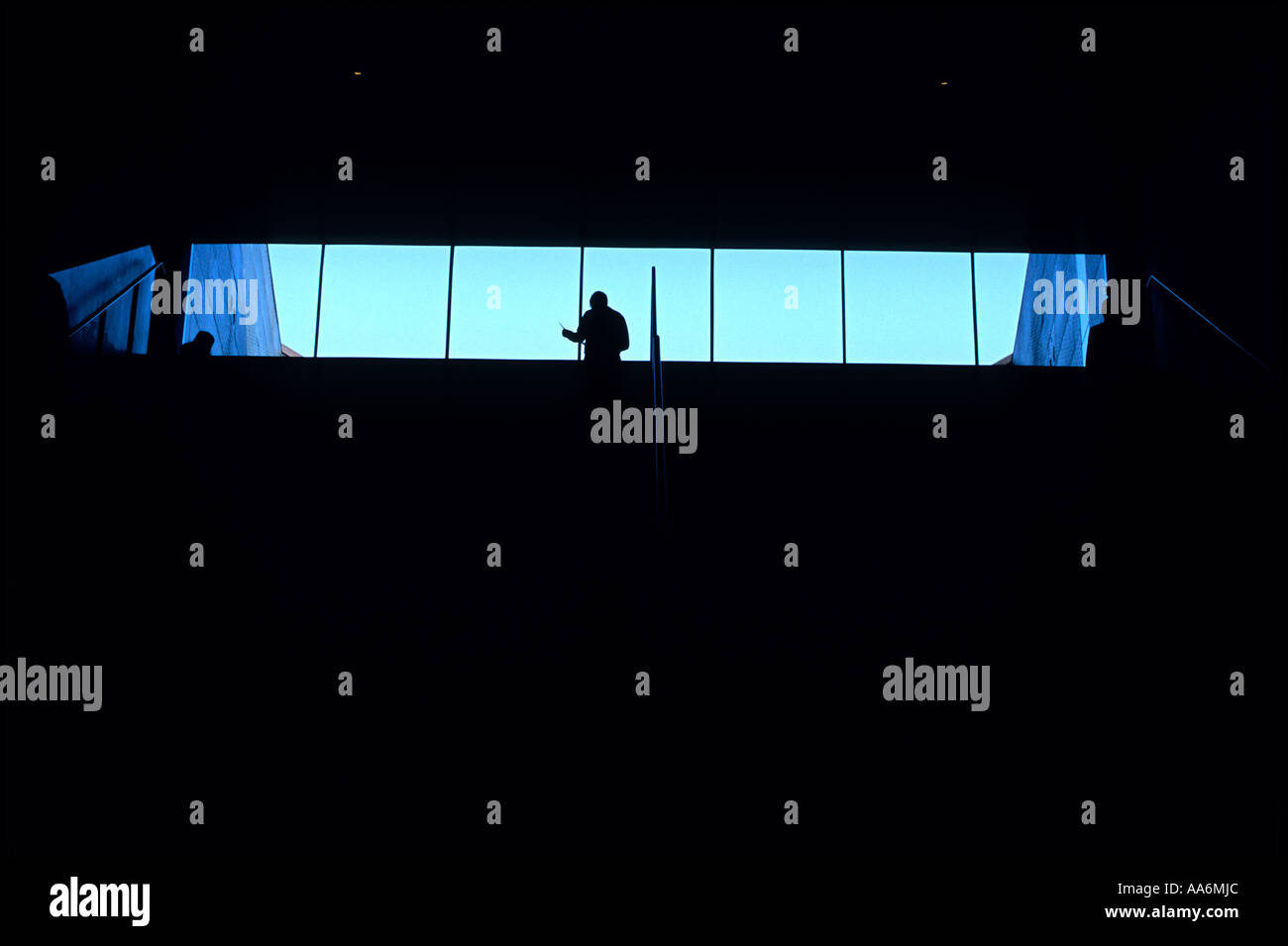 "People silhouetted against window Stock Photo - Alamy