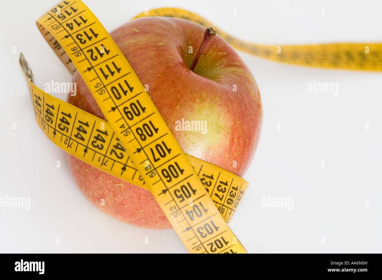 an apple with a meter Stock Photo - Alamy