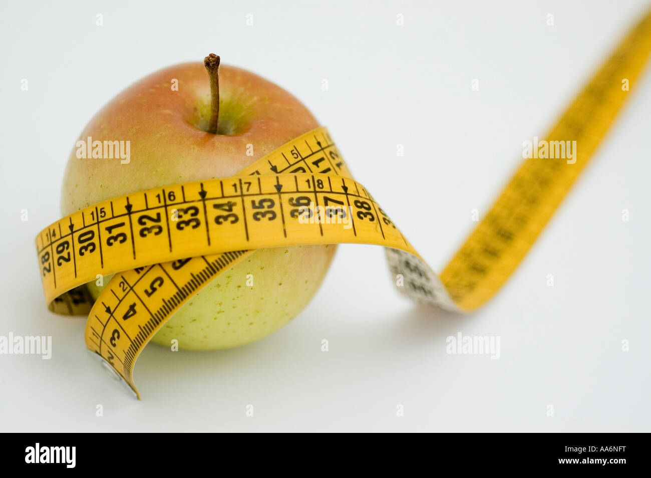An apple with a meter Stock Photo - Alamy