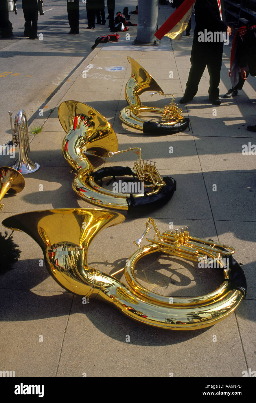 Instruments resting on sidewalk while band members wait for parade to ...