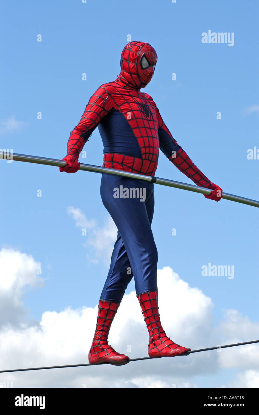 Adult male dressed in a Spiderman costume performing stunts Stock Photo ...