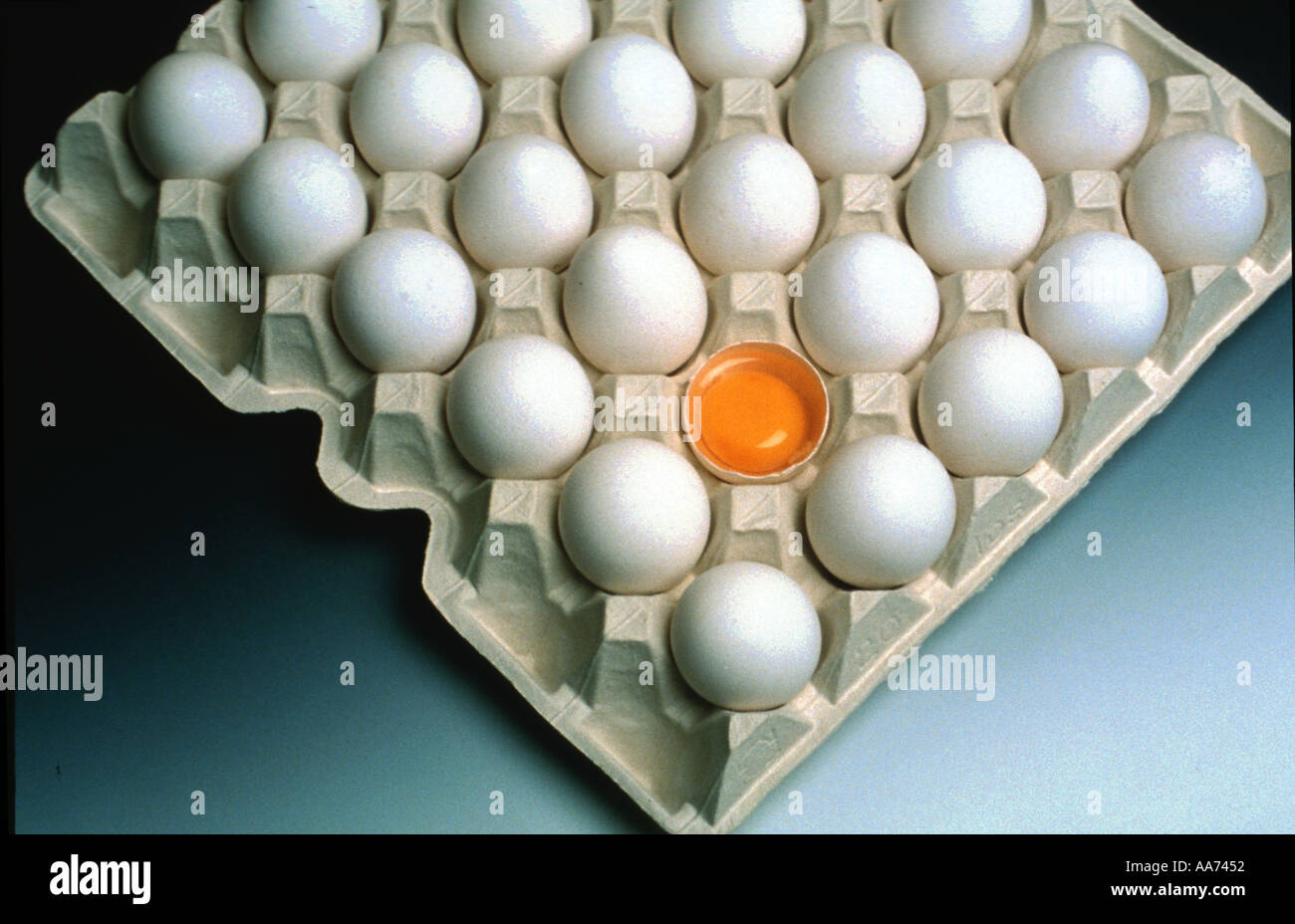 eggs a lot of fresh hen s eggs in a package one open yolk Stock Photo ...