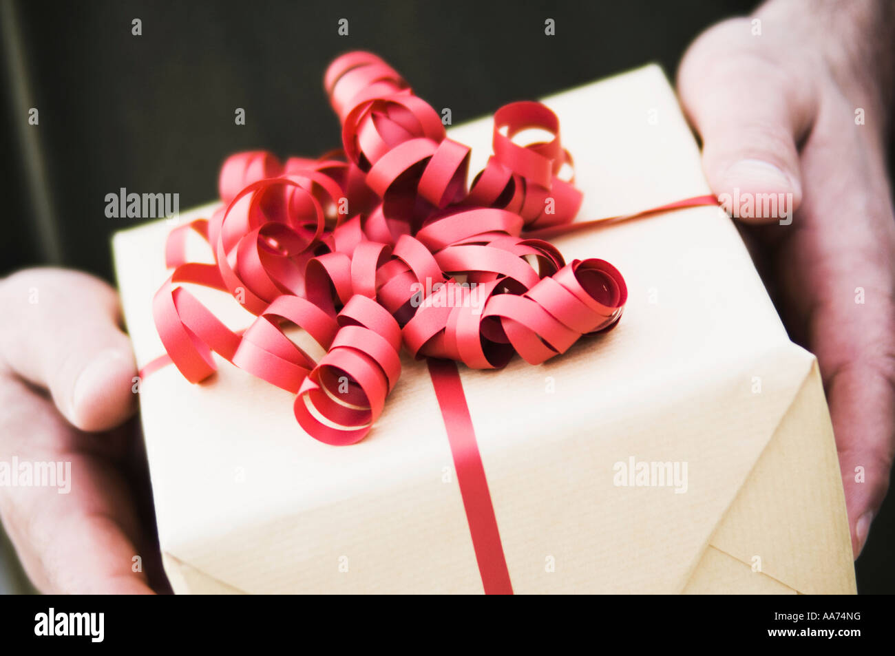 Man holding gift Stock Photo - Alamy