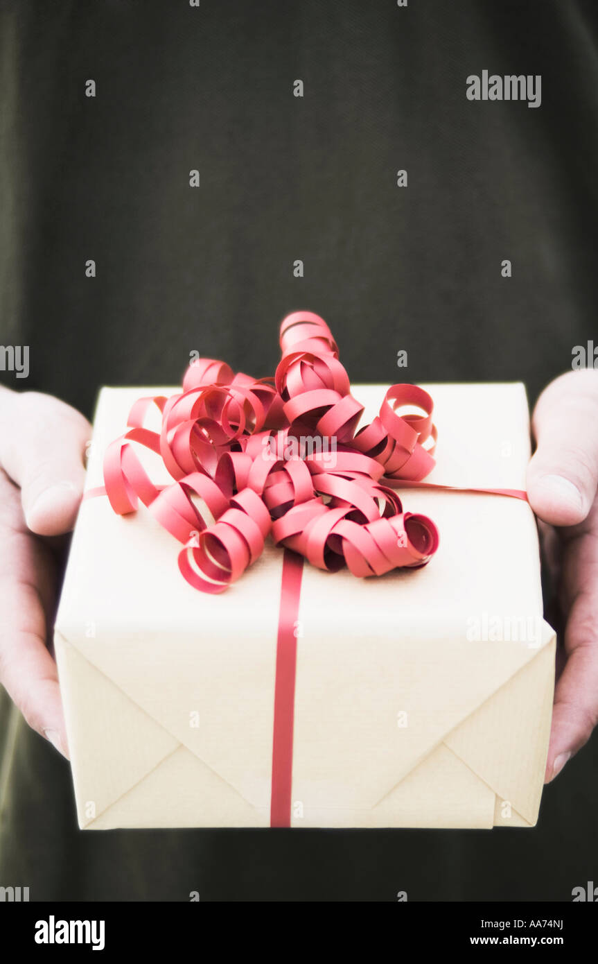 Man holding gift Stock Photo - Alamy