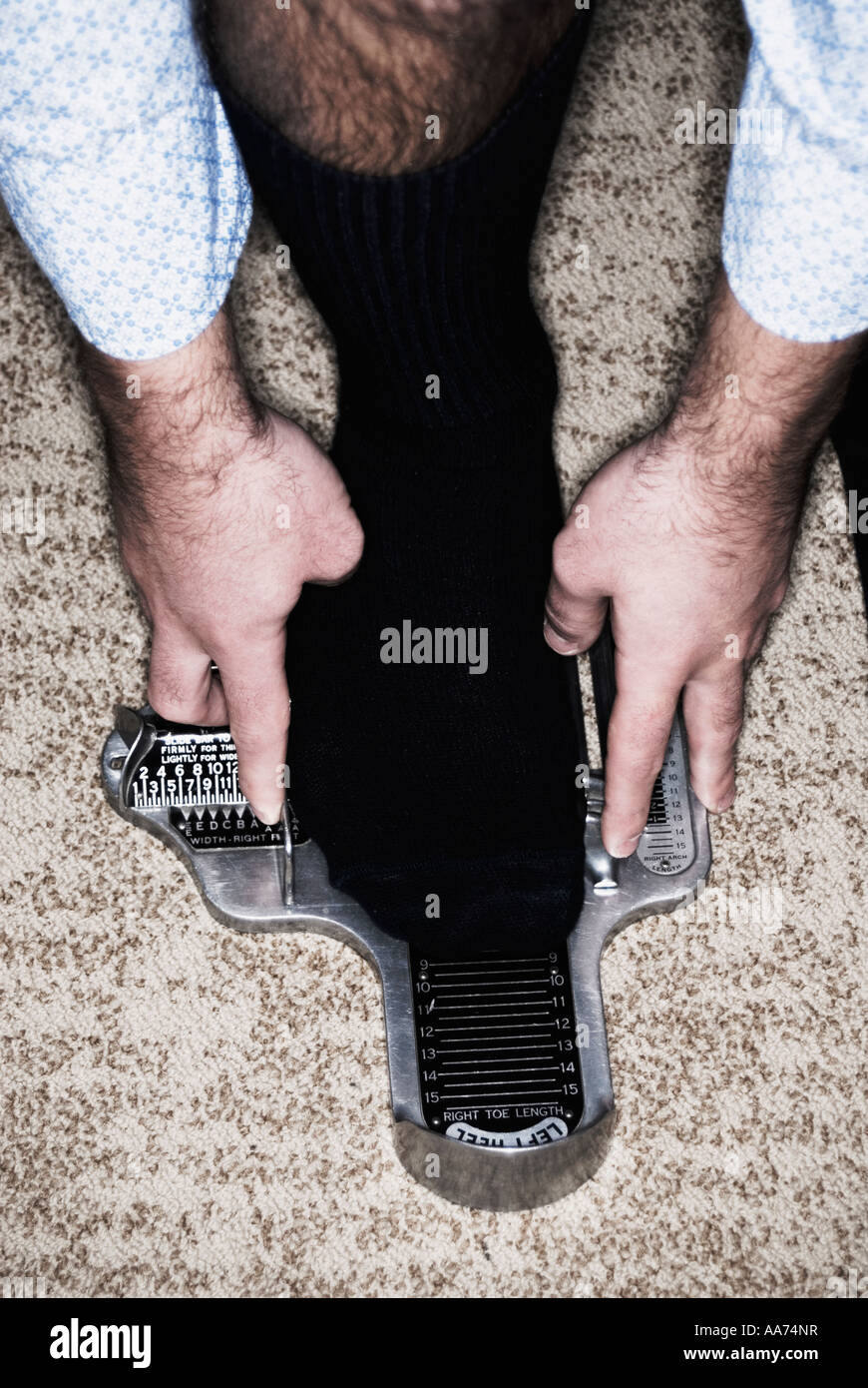 Man getting fitted for shoes Stock Photo - Alamy