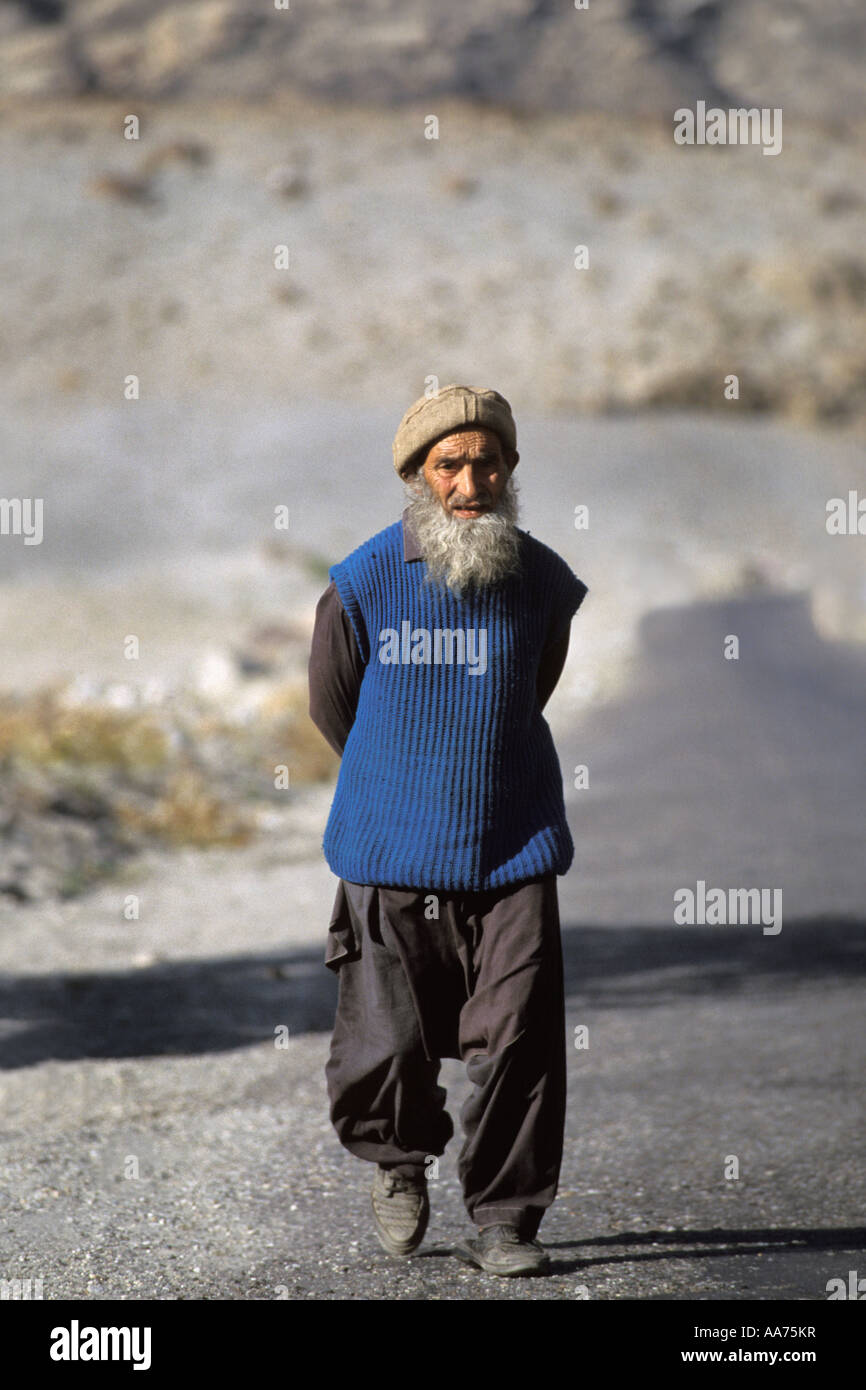 Pakistan, Karakoram Highway, Man walking on the road near Gilgit Stock ...