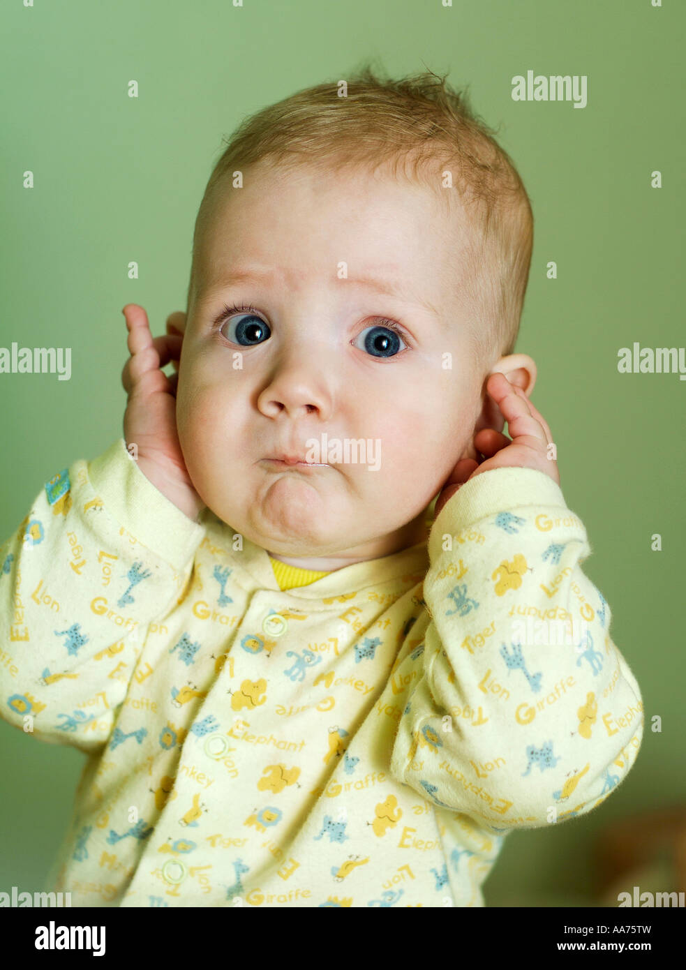 Kid plugging ears hi-res stock photography and images - Alamy