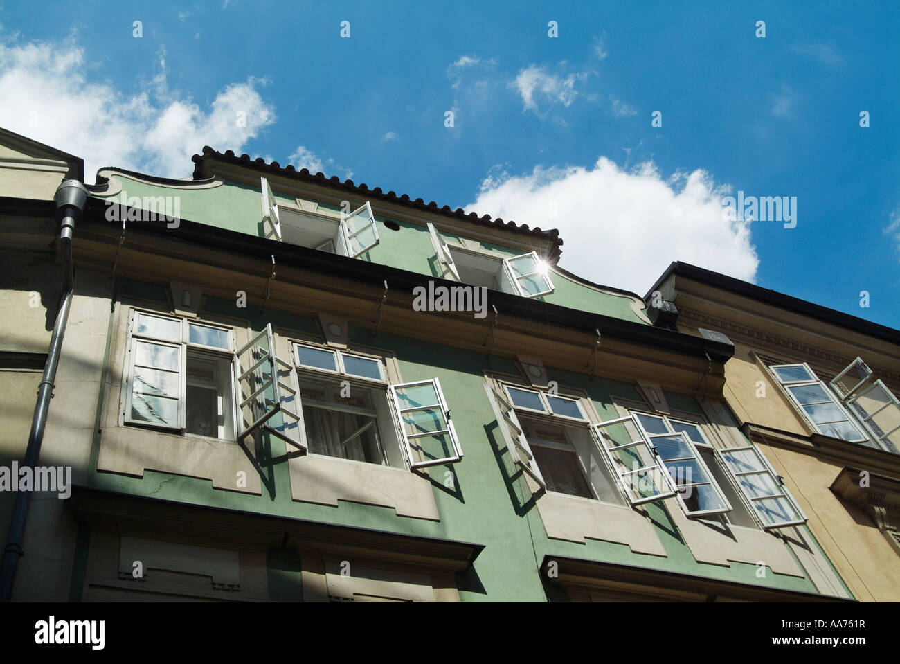 Apartment building with windows open Stock Photo - Alamy