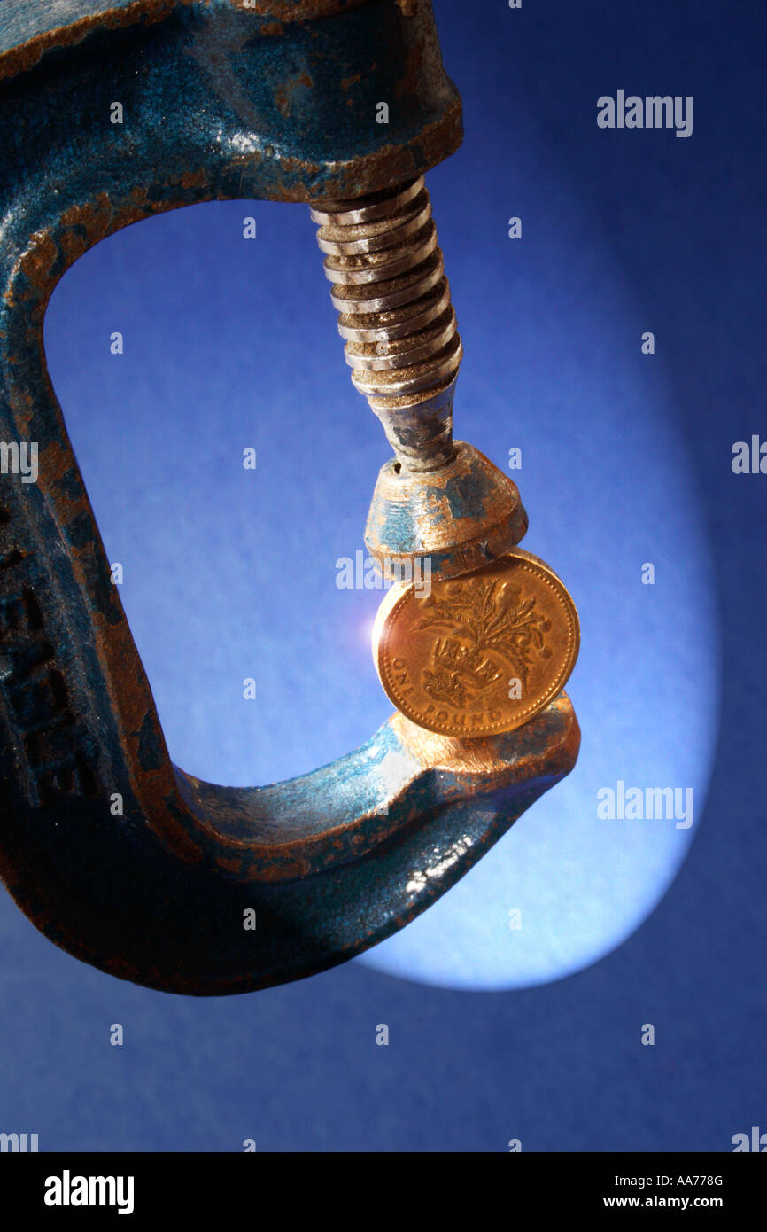 Squeezing the pound Stock Photo - Alamy