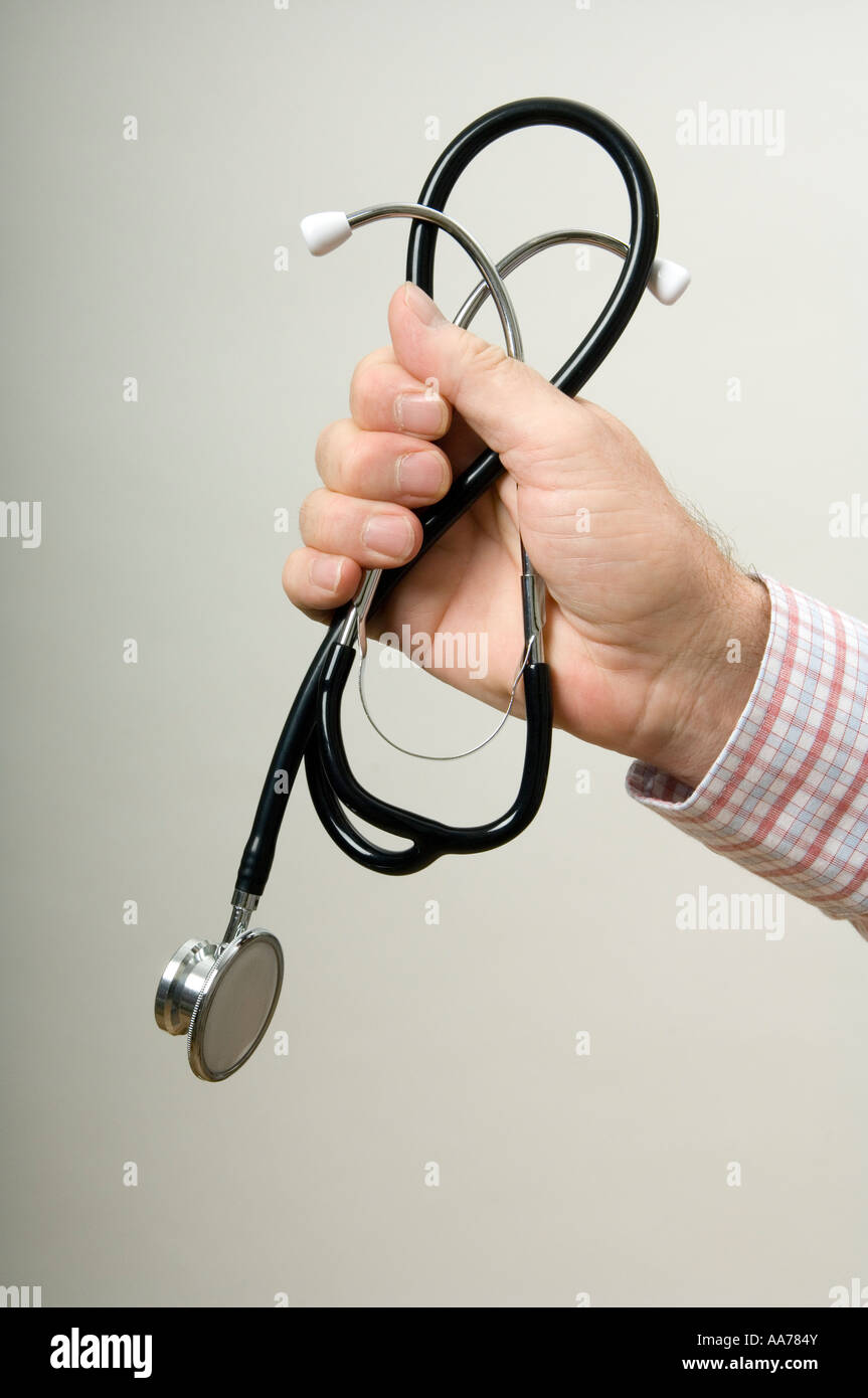 A hand holding out a medical stethoscope Stock Photo - Alamy