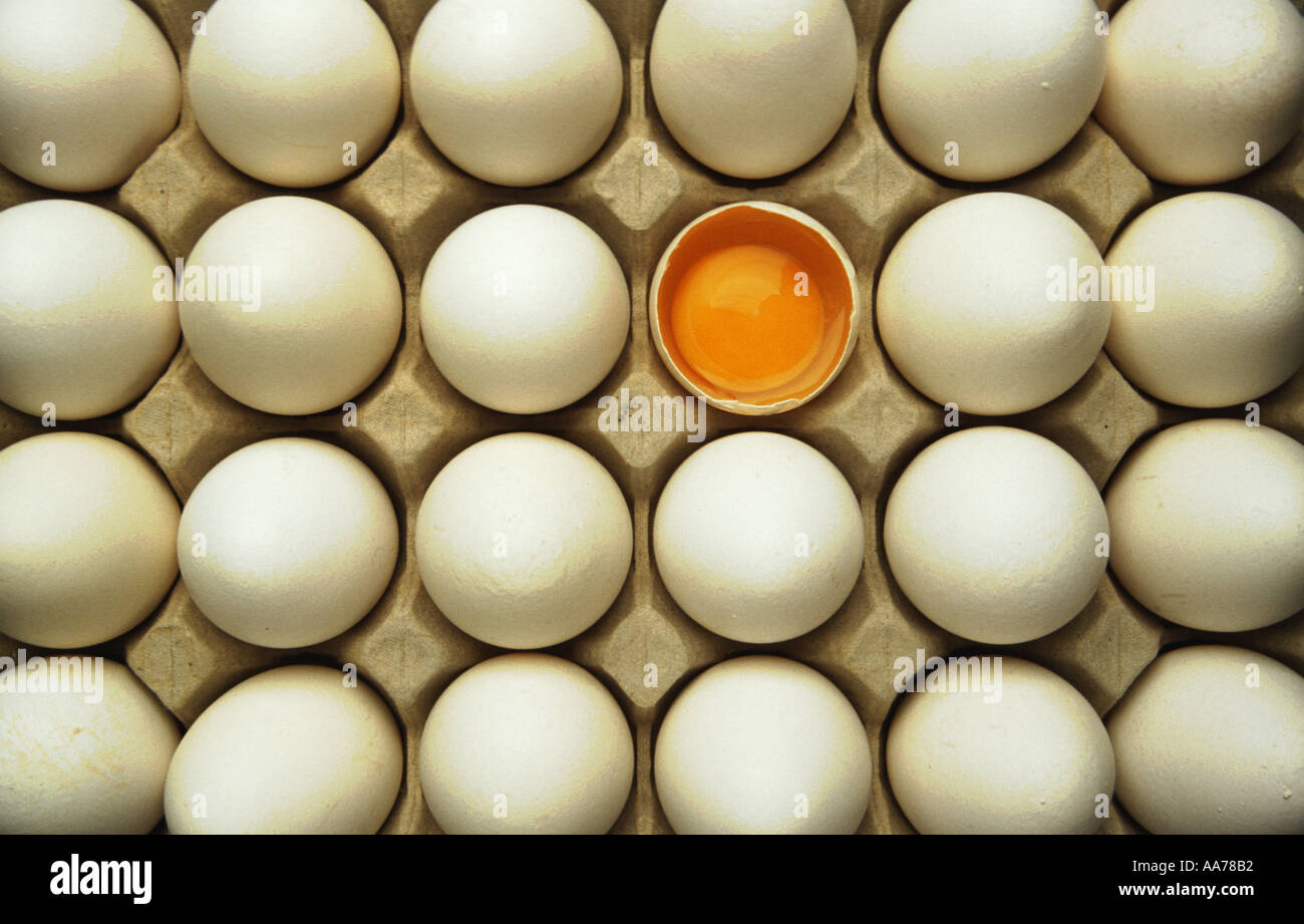 white eggs one open with yolk eggshell Stock Photo - Alamy