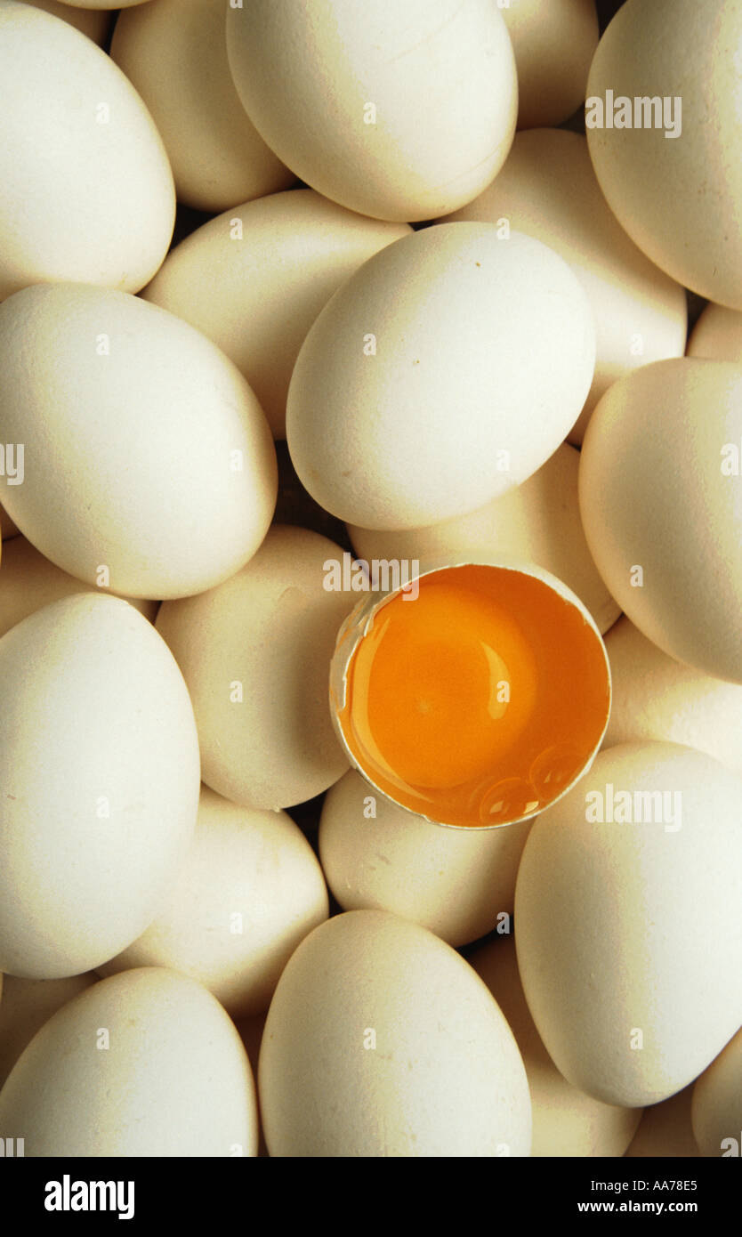 white eggs one open with yolk eggshell Stock Photo - Alamy