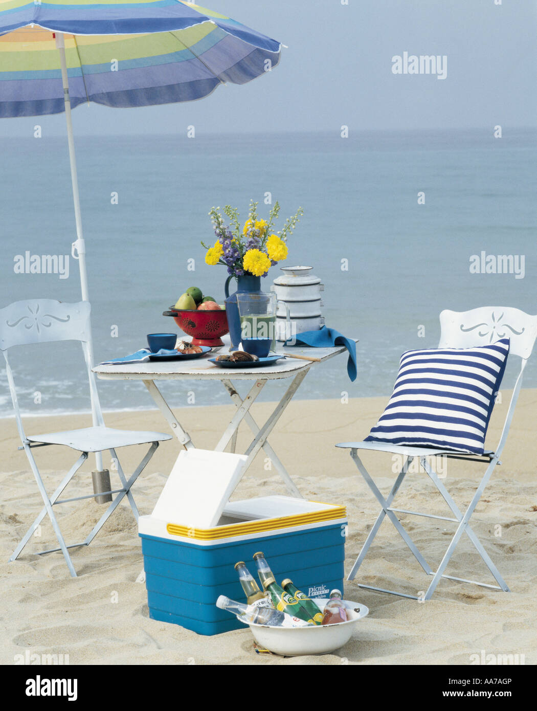 Table and chair on a beach Stock Photo - Alamy