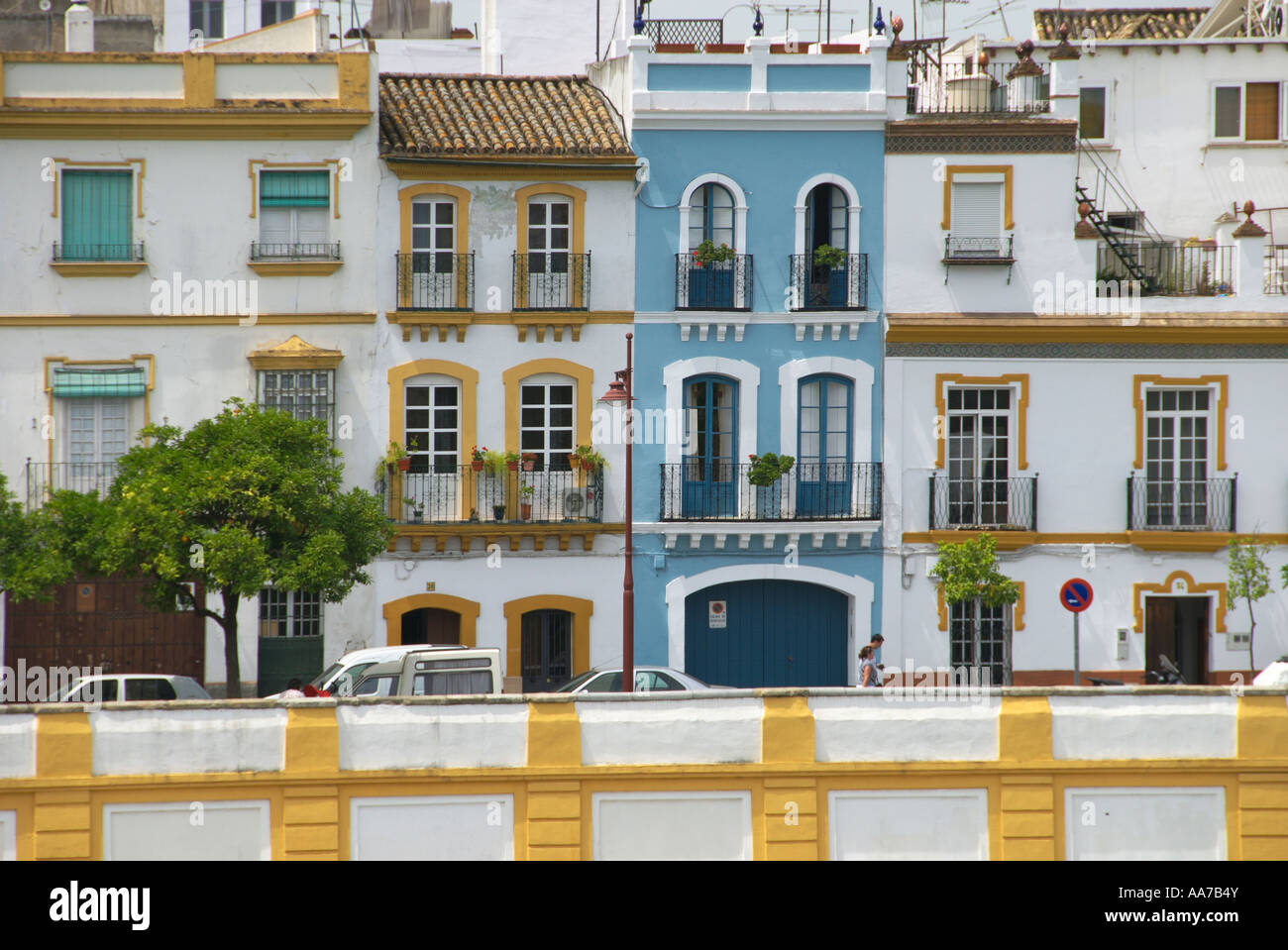 Colourful riverside houses, Seville Stock Photo - Alamy