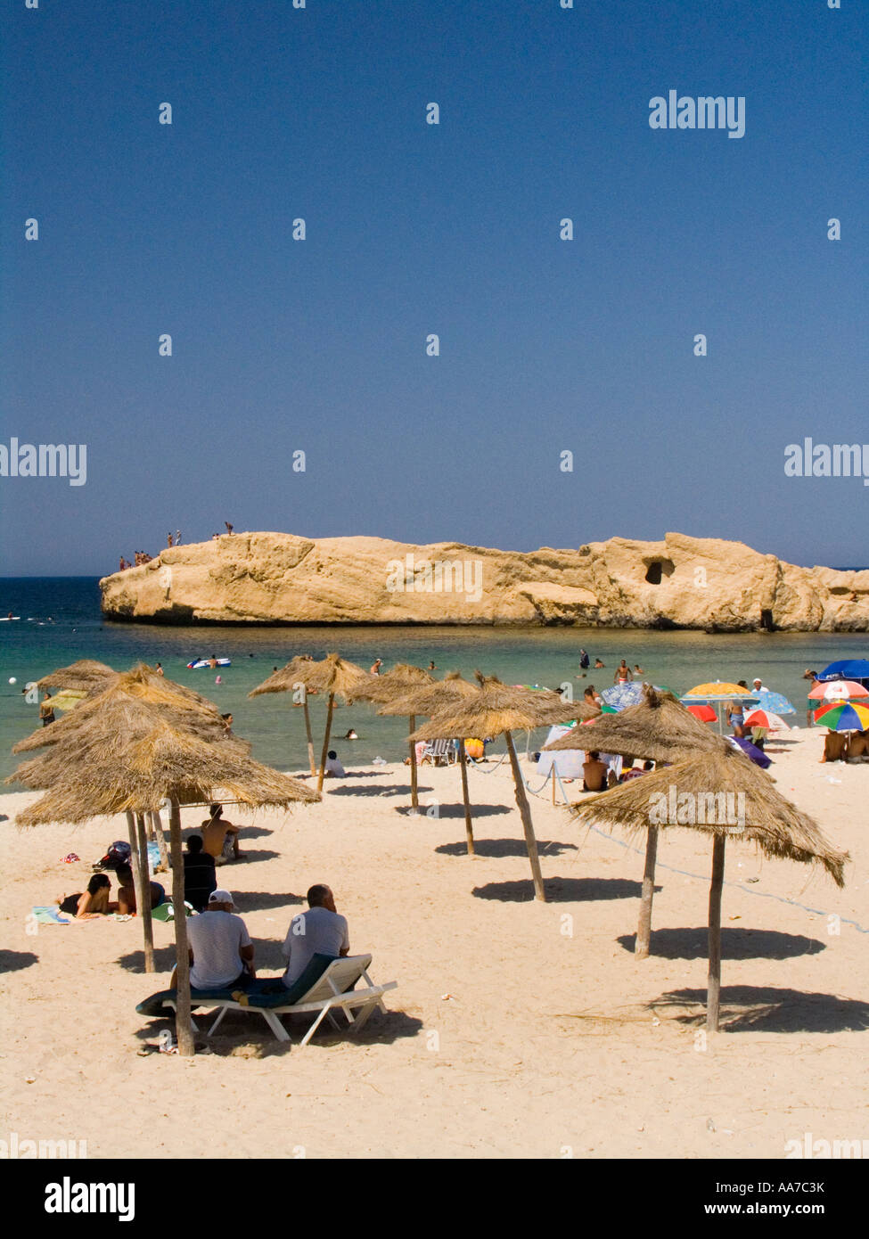 Thatch sunshades Monastir Beach Tunisia Stock Photo - Alamy