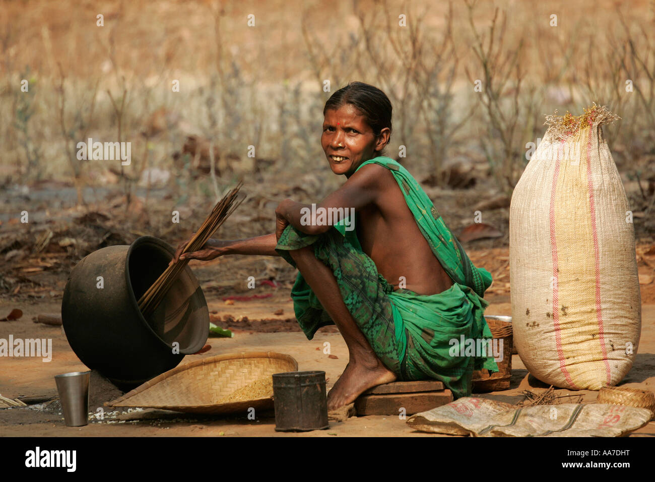 Woman cooking at a Kutia Kondh village near Baliguda, Orissa, India ...