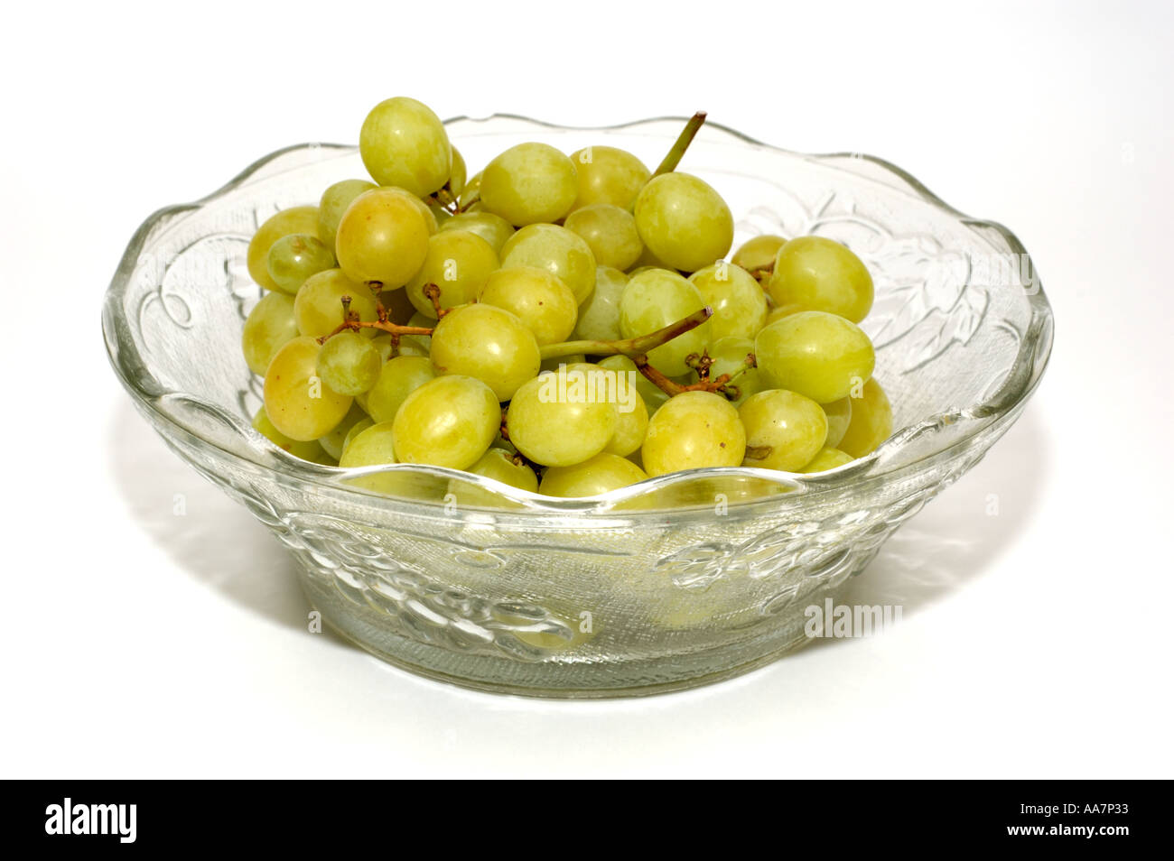 Bunch of grapes on plate White background Stock Photo - Alamy