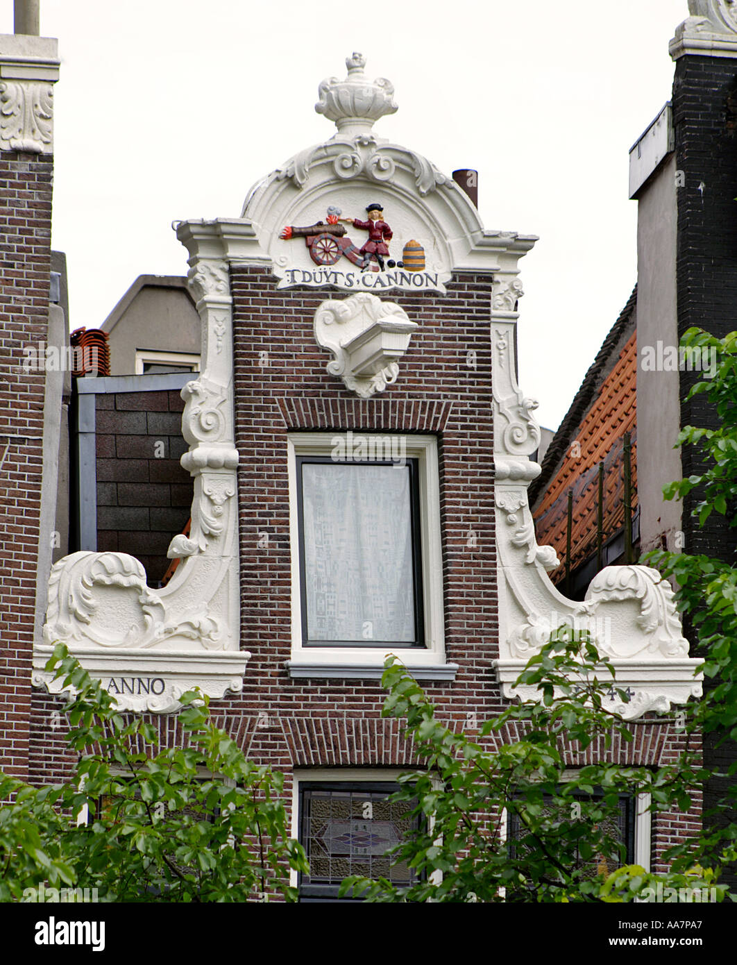 Historic Dutch Neck Gable with man firing cannon on the motif on the ...