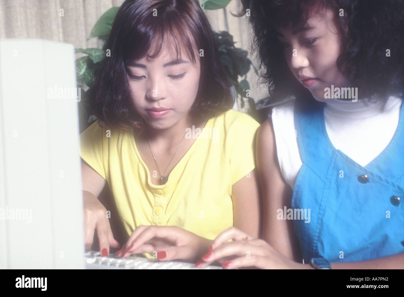 Asian teens computer hi-res stock photography and images - Alamy