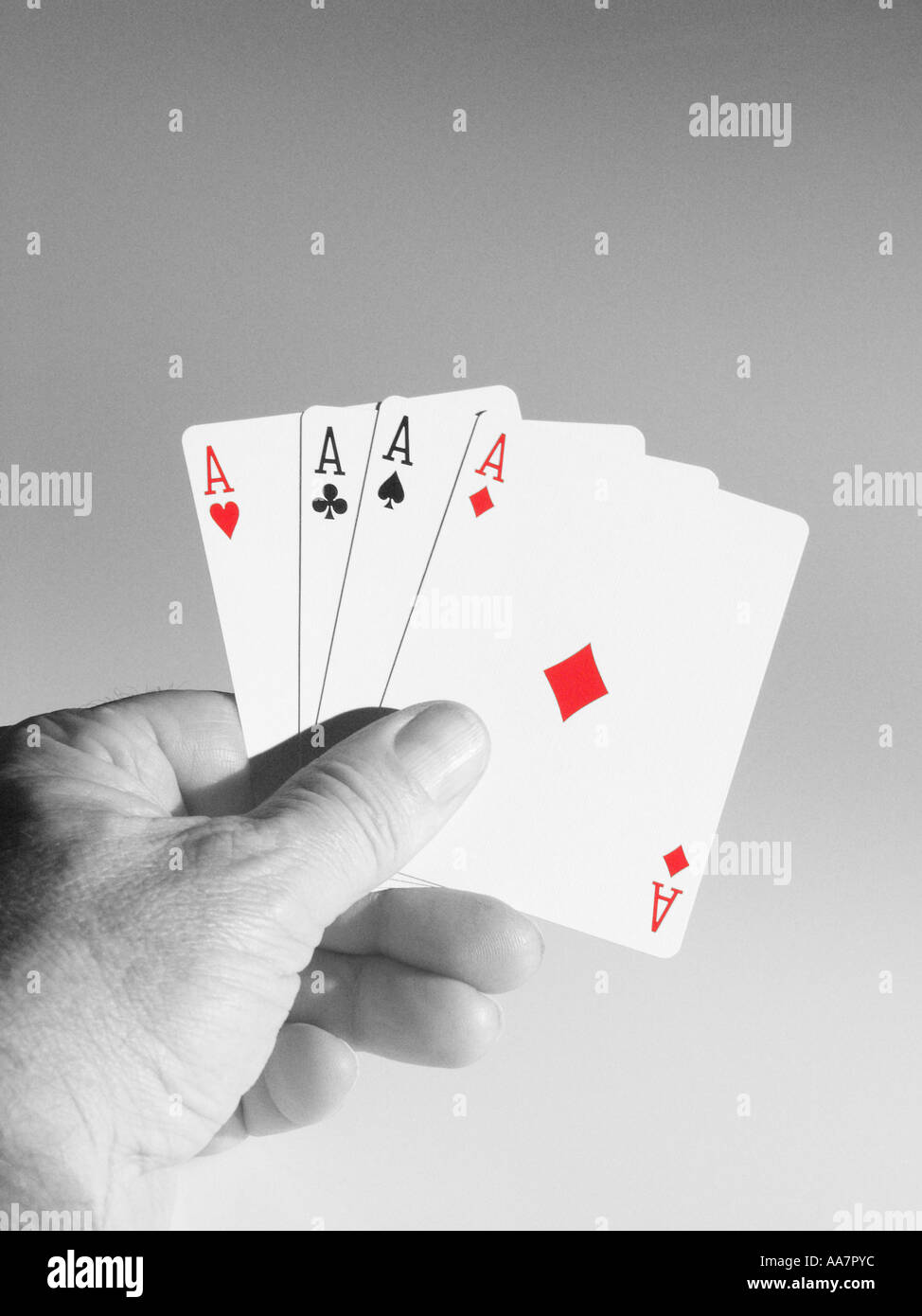 Hand holding four aces Stock Photo - Alamy