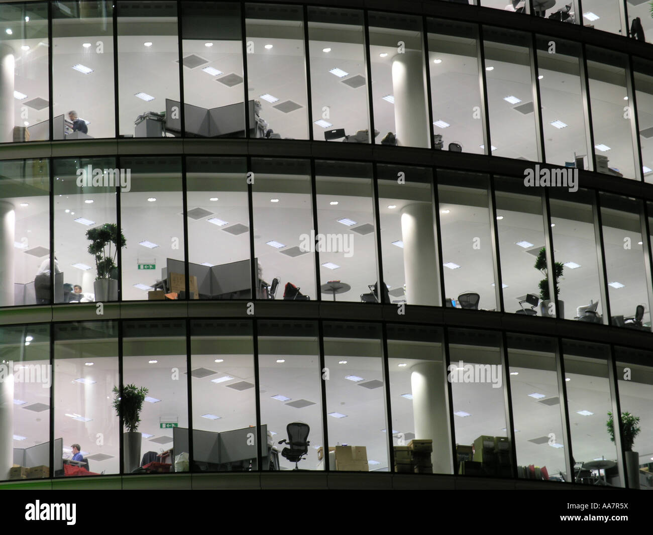 night time office building workers doing overtime city of london ...